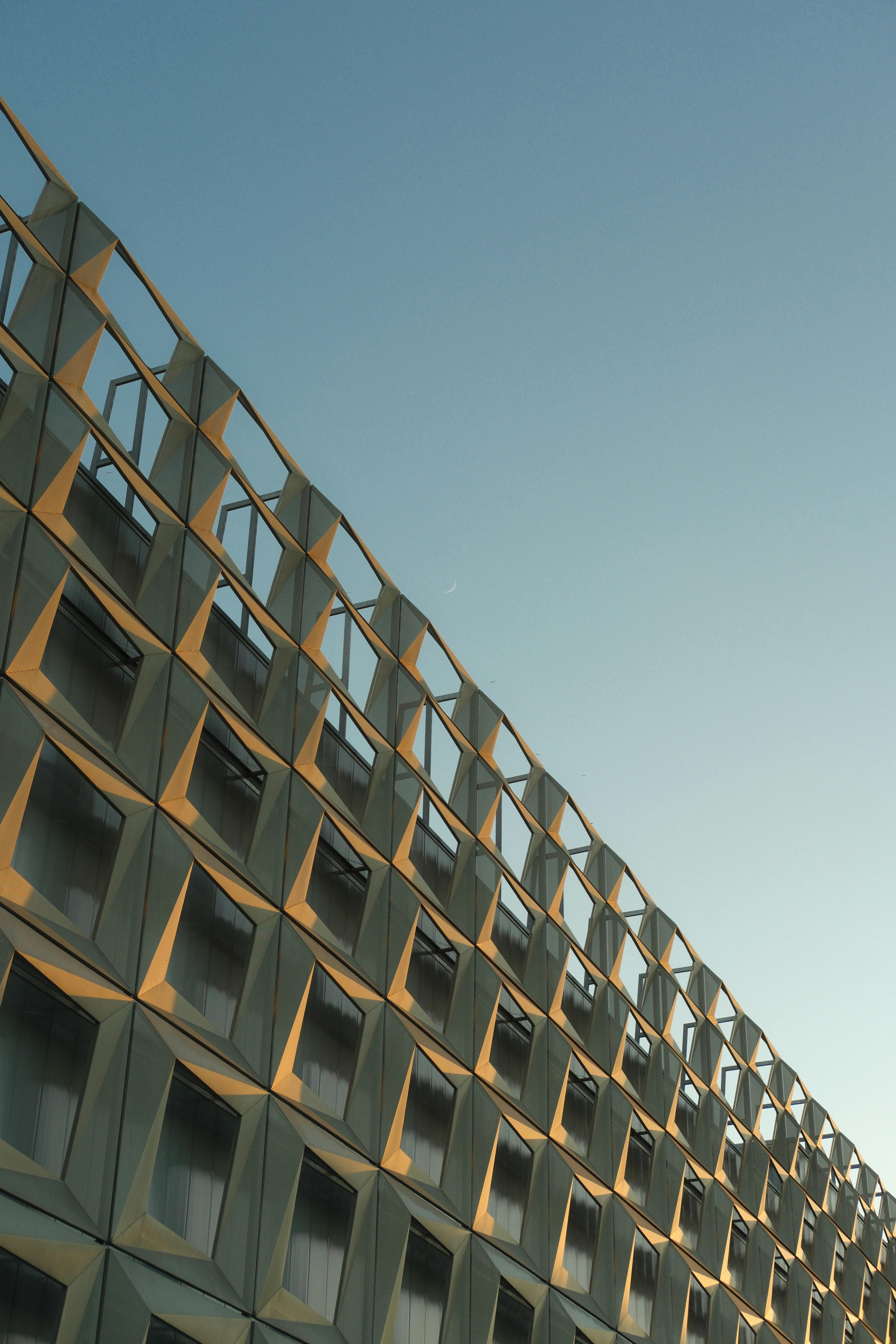 Modern Architectural Facade with Geometric Patterns · Free Stock Photo