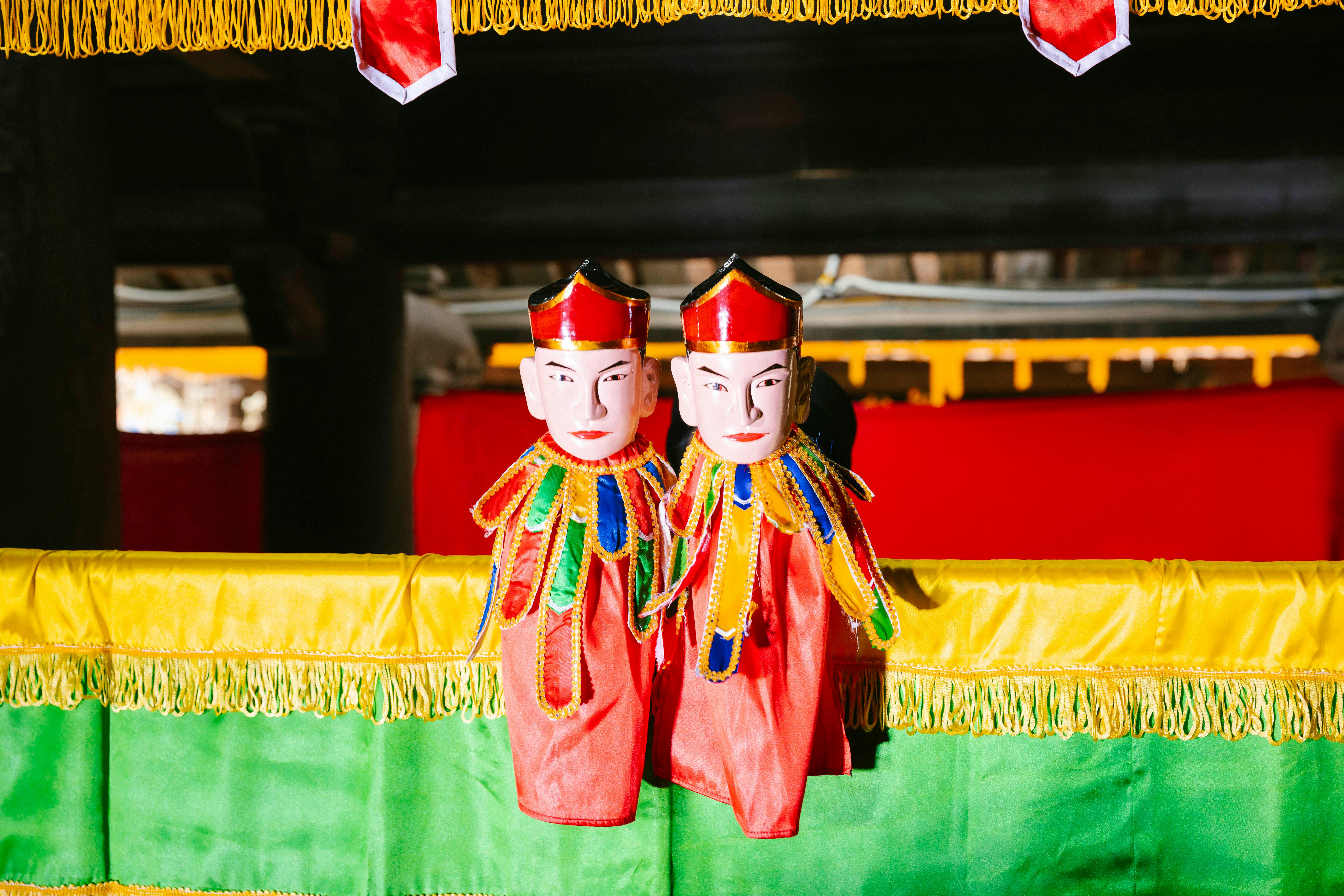 Colorful Puppets in Traditional Asian Setting · Free Stock Photo