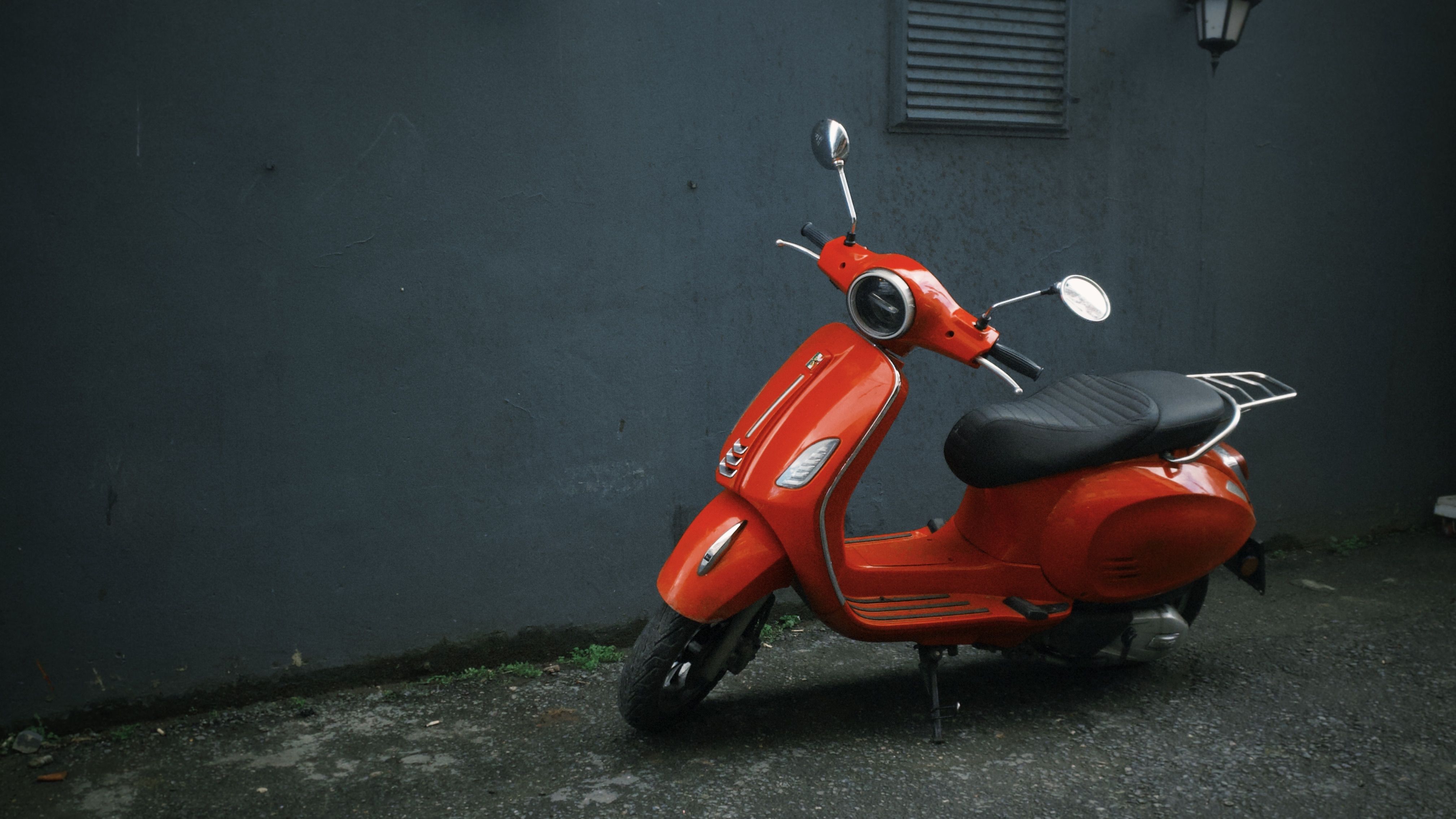 Vibrant Red Scooter in Urban Setting · Free Stock Photo
