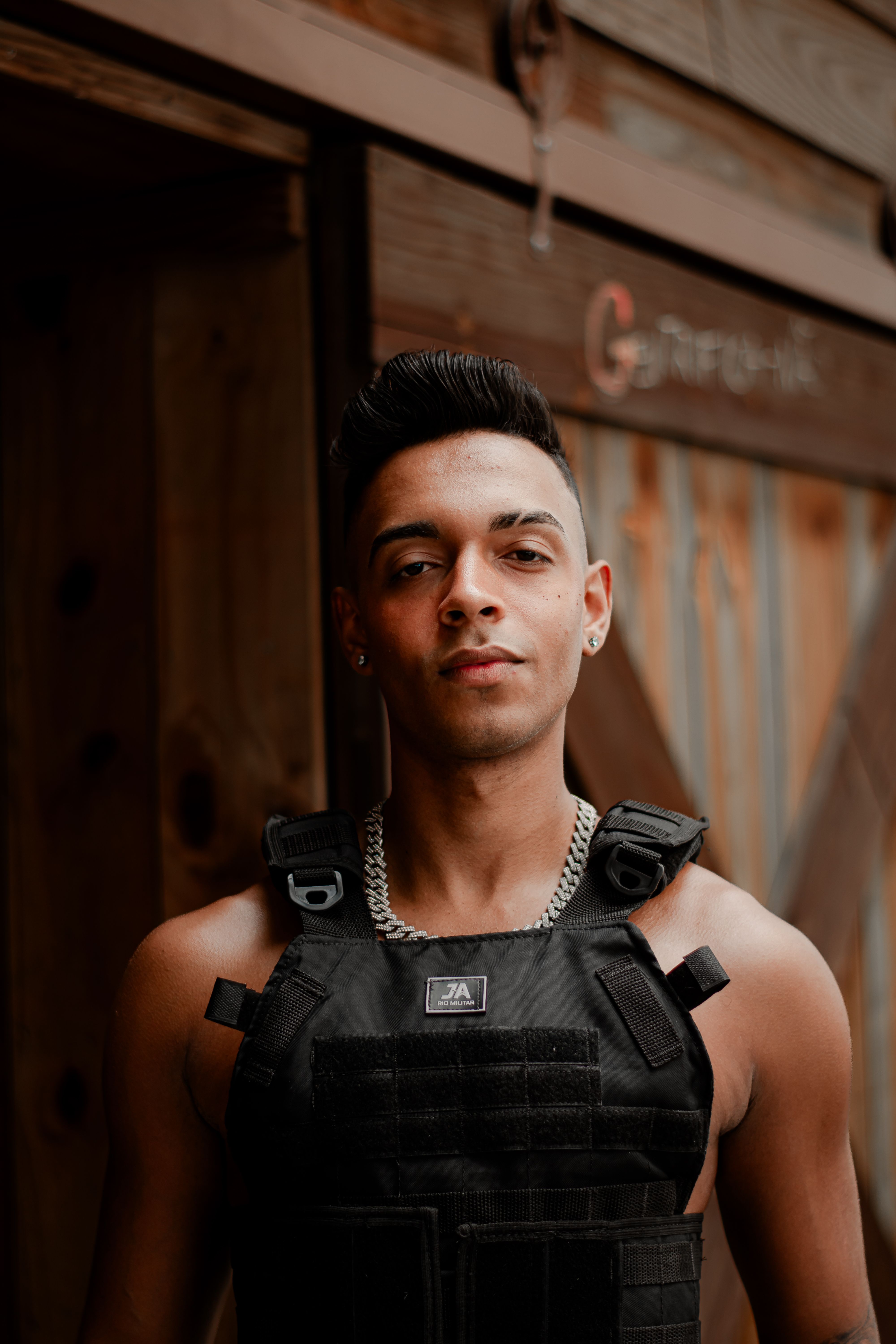 Portrait of a Confident Young Man in Tactical Gear · Free Stock Photo