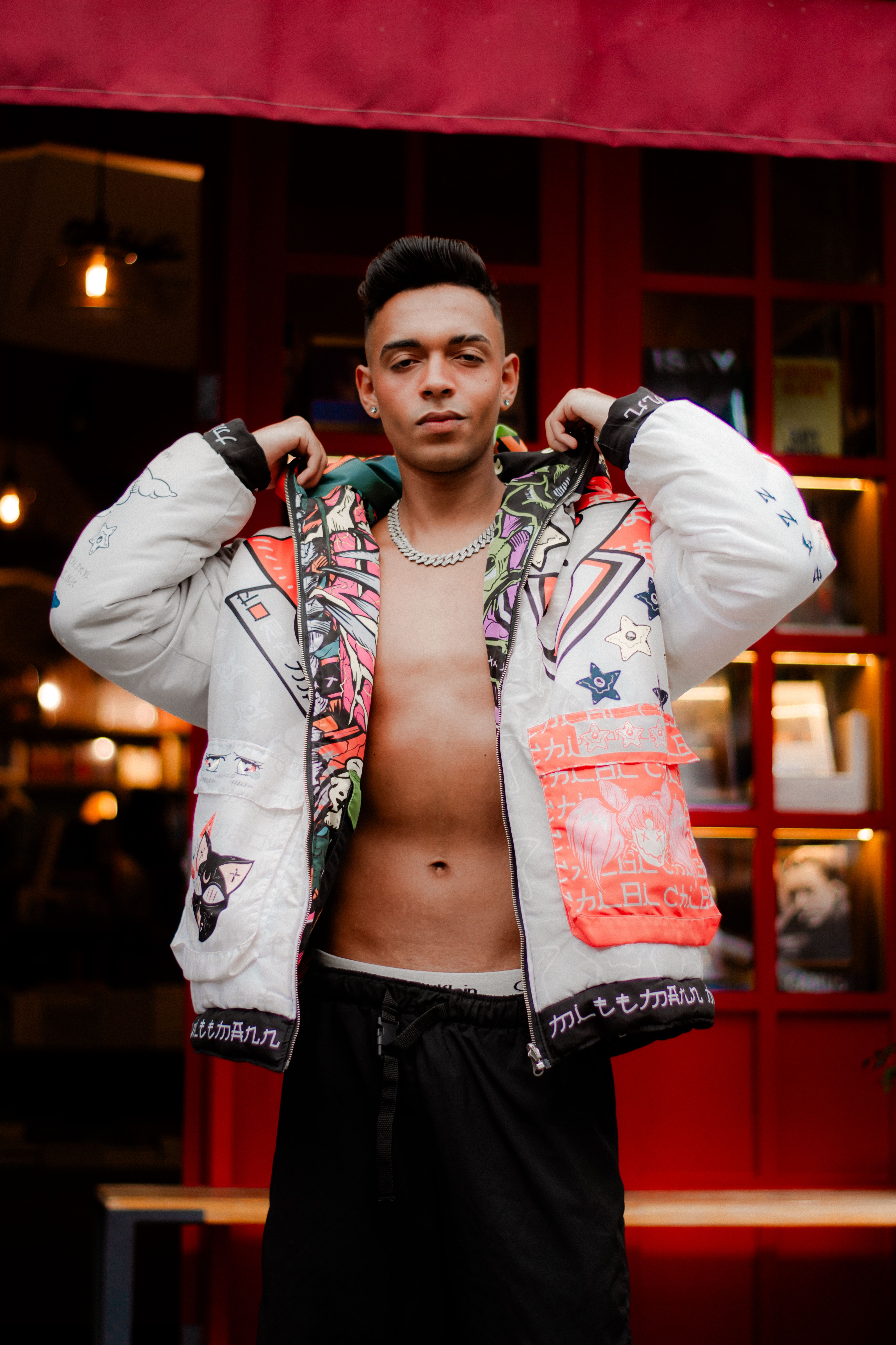 Fashionable Young Man in Vibrant Jacket Outdoors · Free Stock Photo