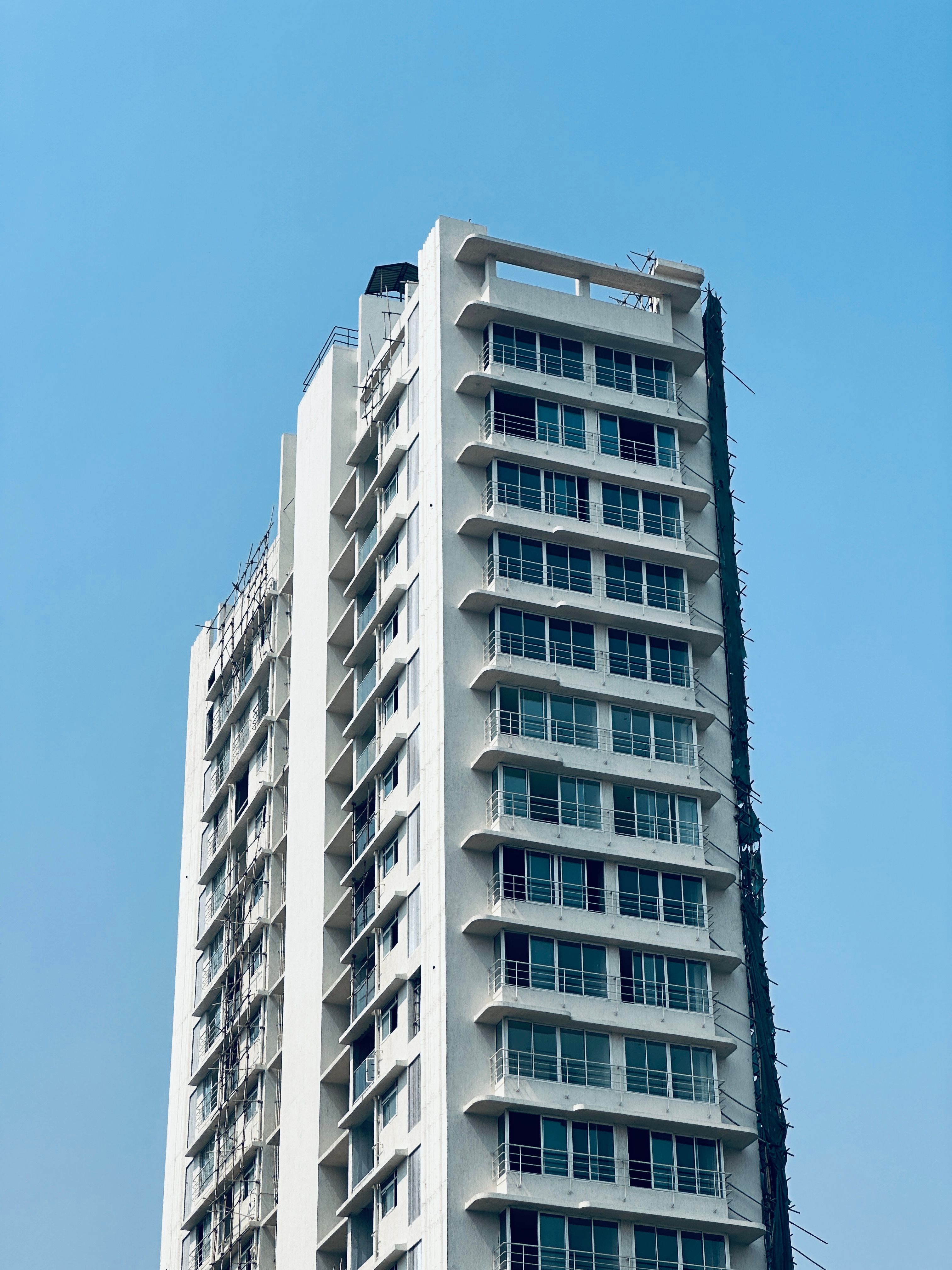 Modern High-Rise Building Against Clear Sky · Free Stock Photo