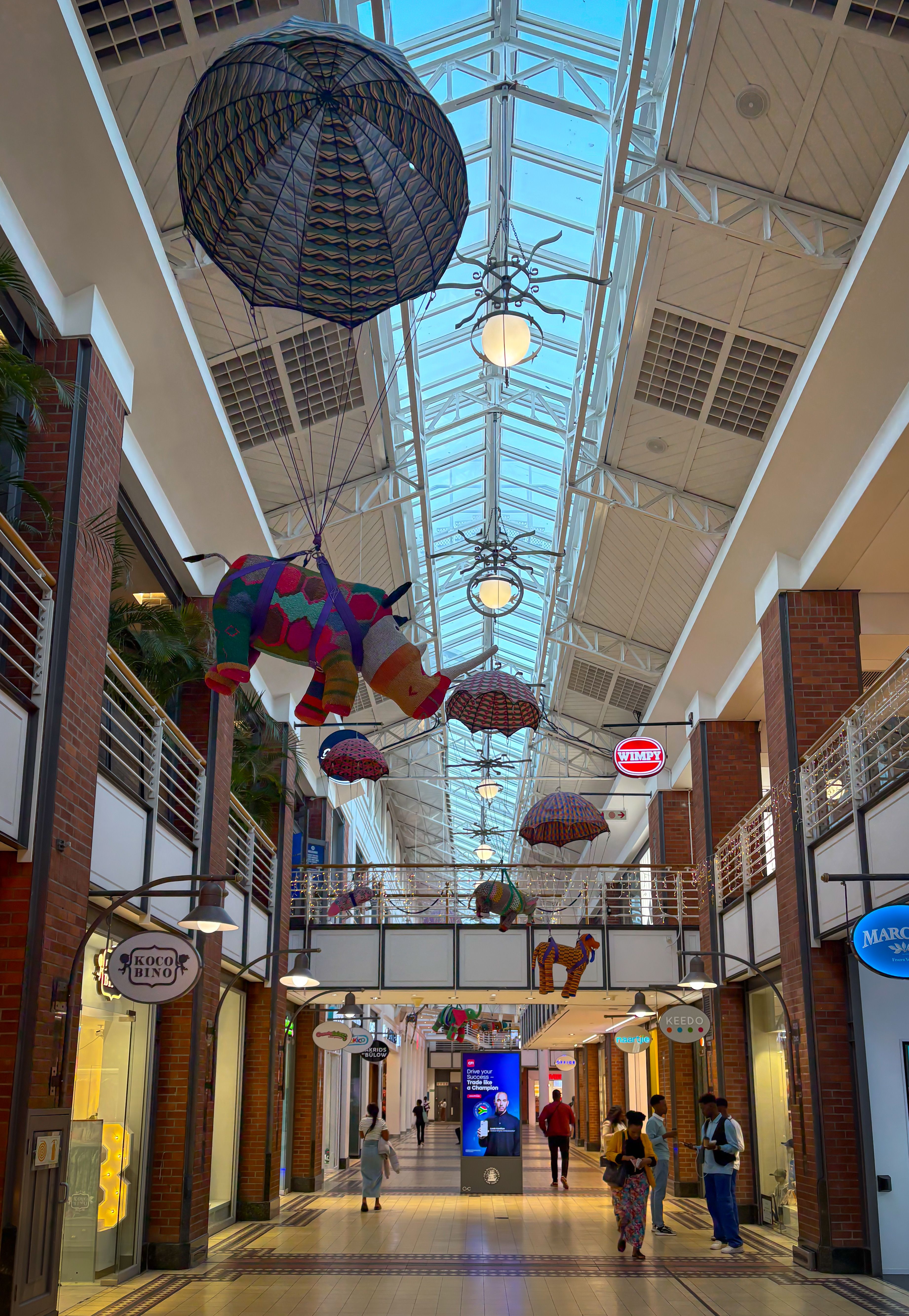 Vibrant Shopping Arcade with Artistic Decor · Free Stock Photo