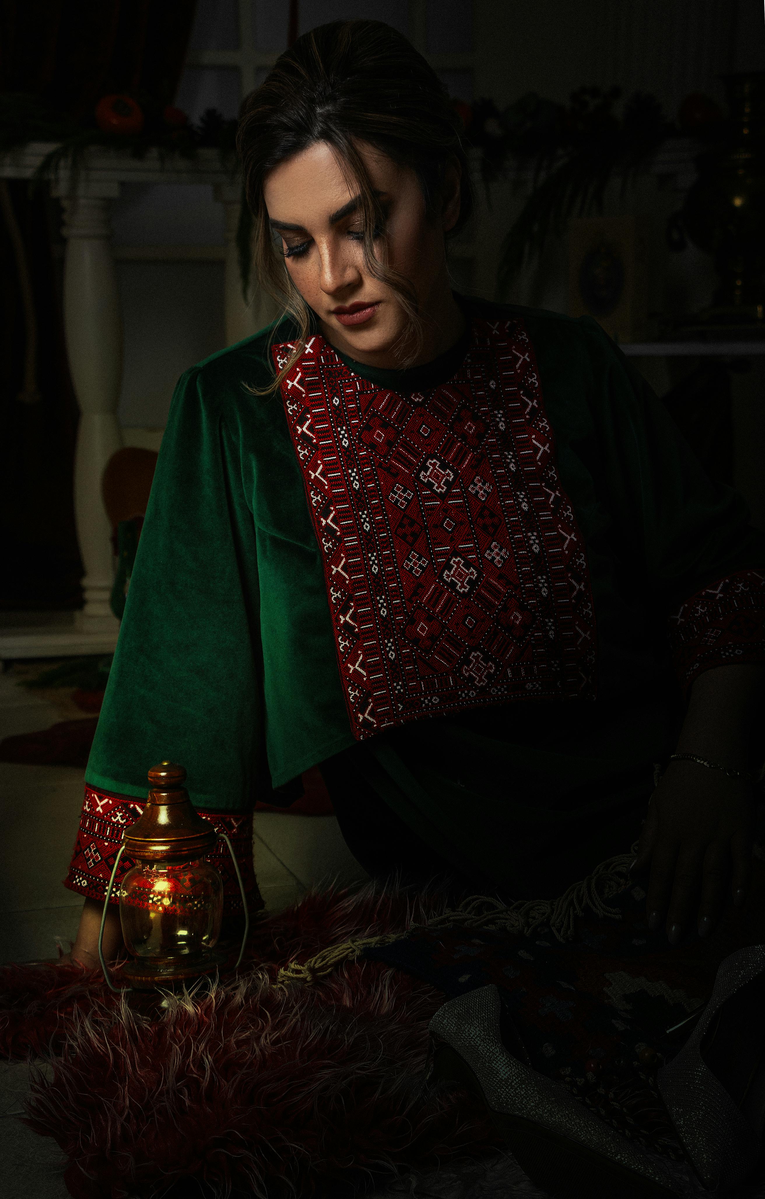 Traditional Attire in Dim Candlelit Ambiance · Free Stock Photo
