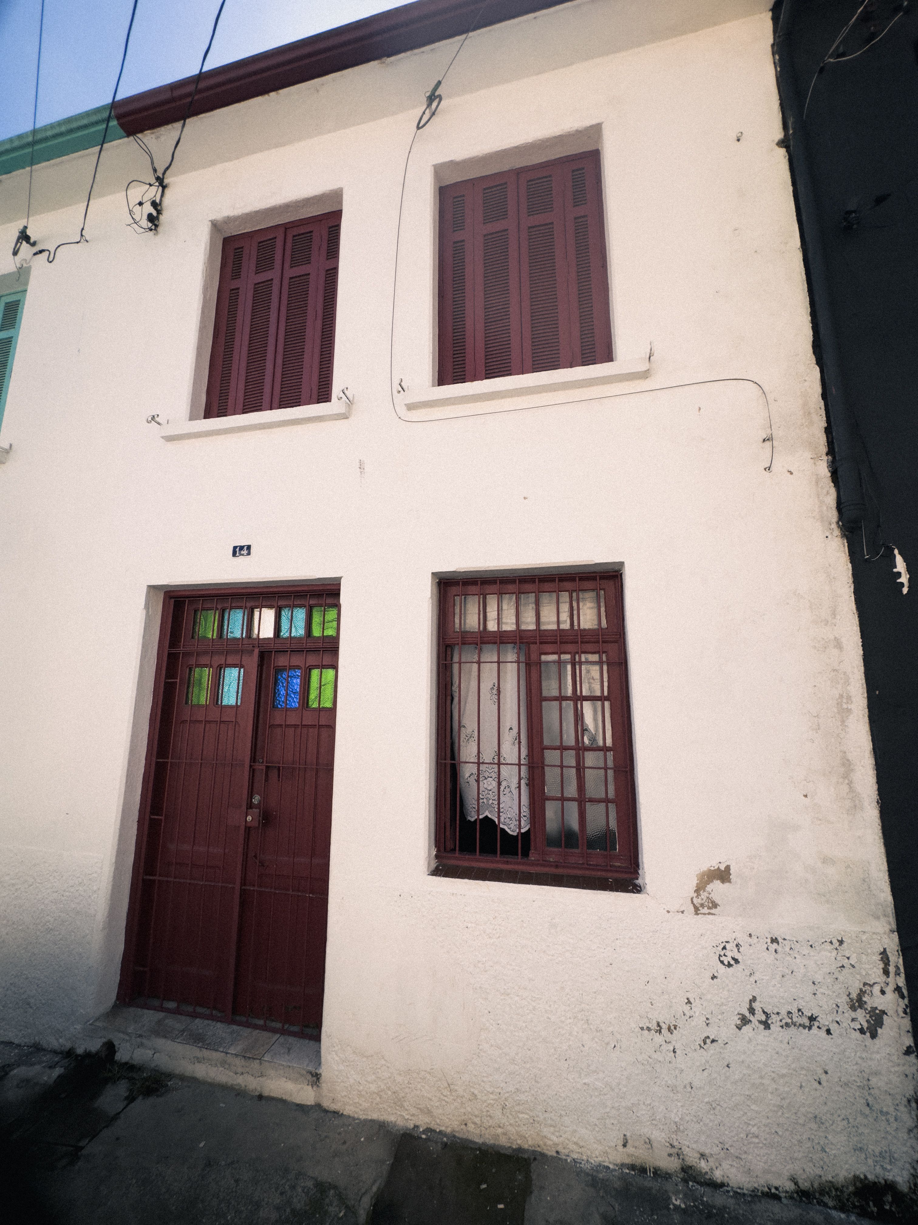 Traditional Urban House Facade with Closed Shutters · Free Stock Photo