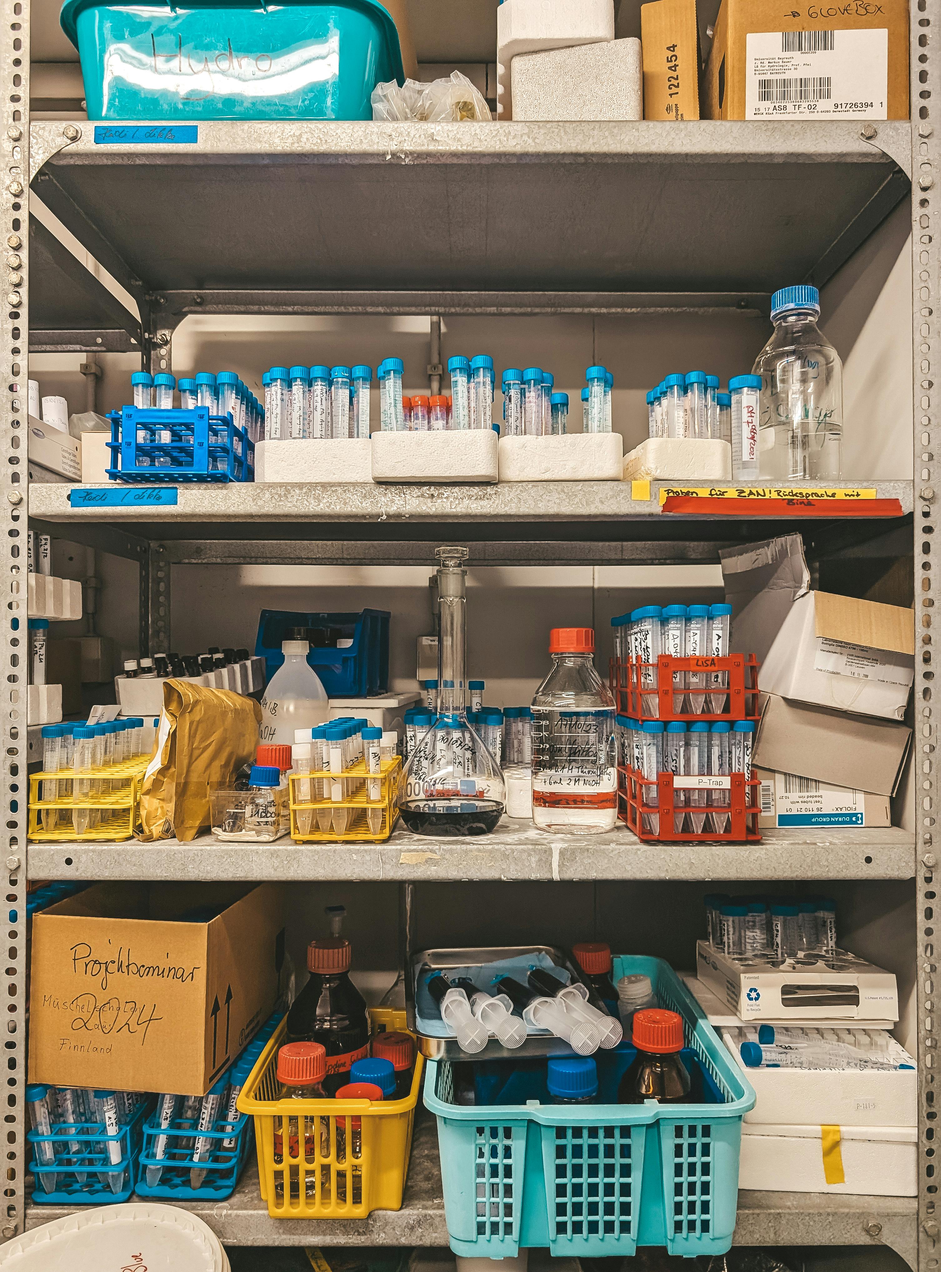 Organized Laboratory Shelf with Equipment and Supplies · Free Stock Photo