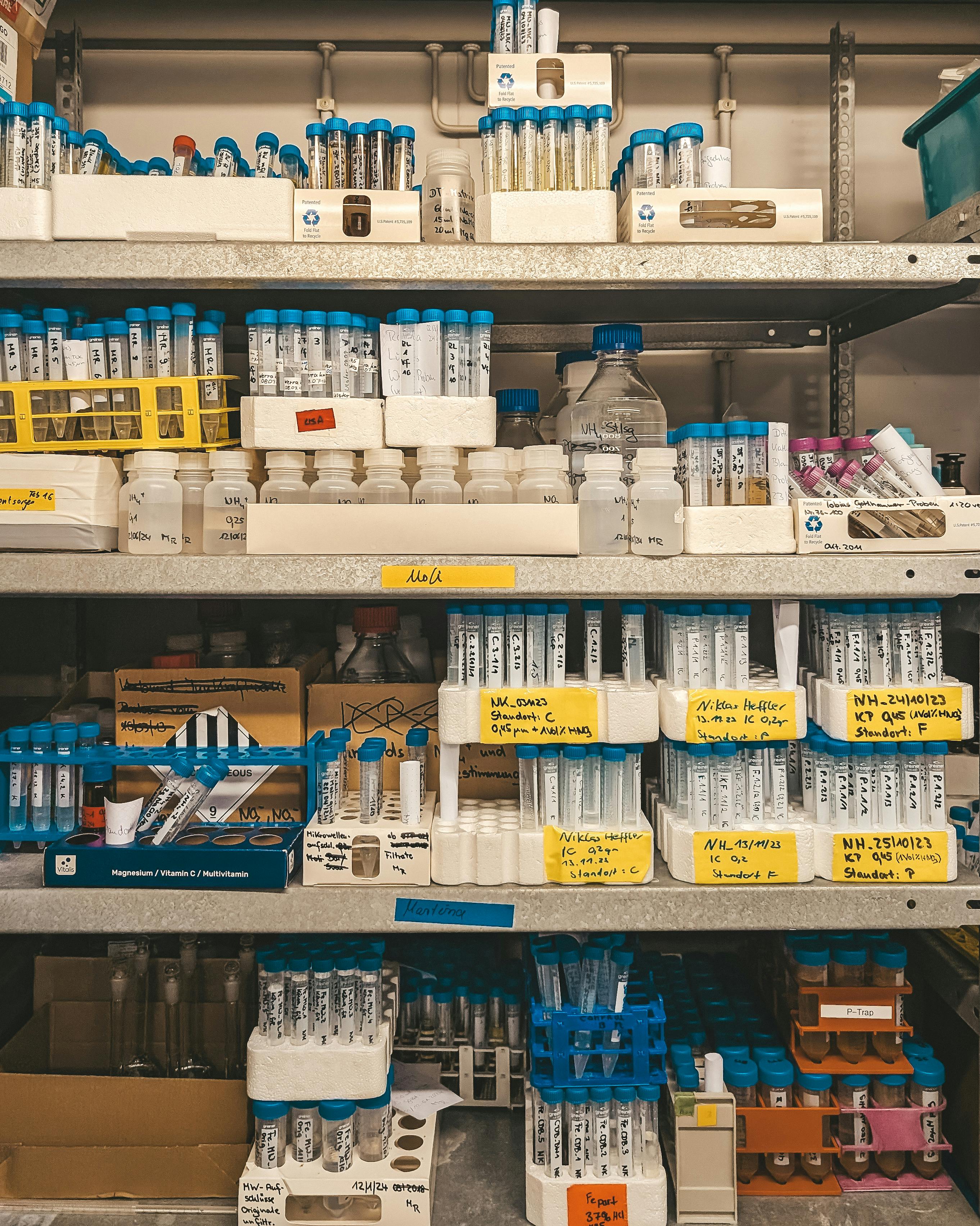 Organized Laboratory Shelf with Chemical Vials · Free Stock Photo