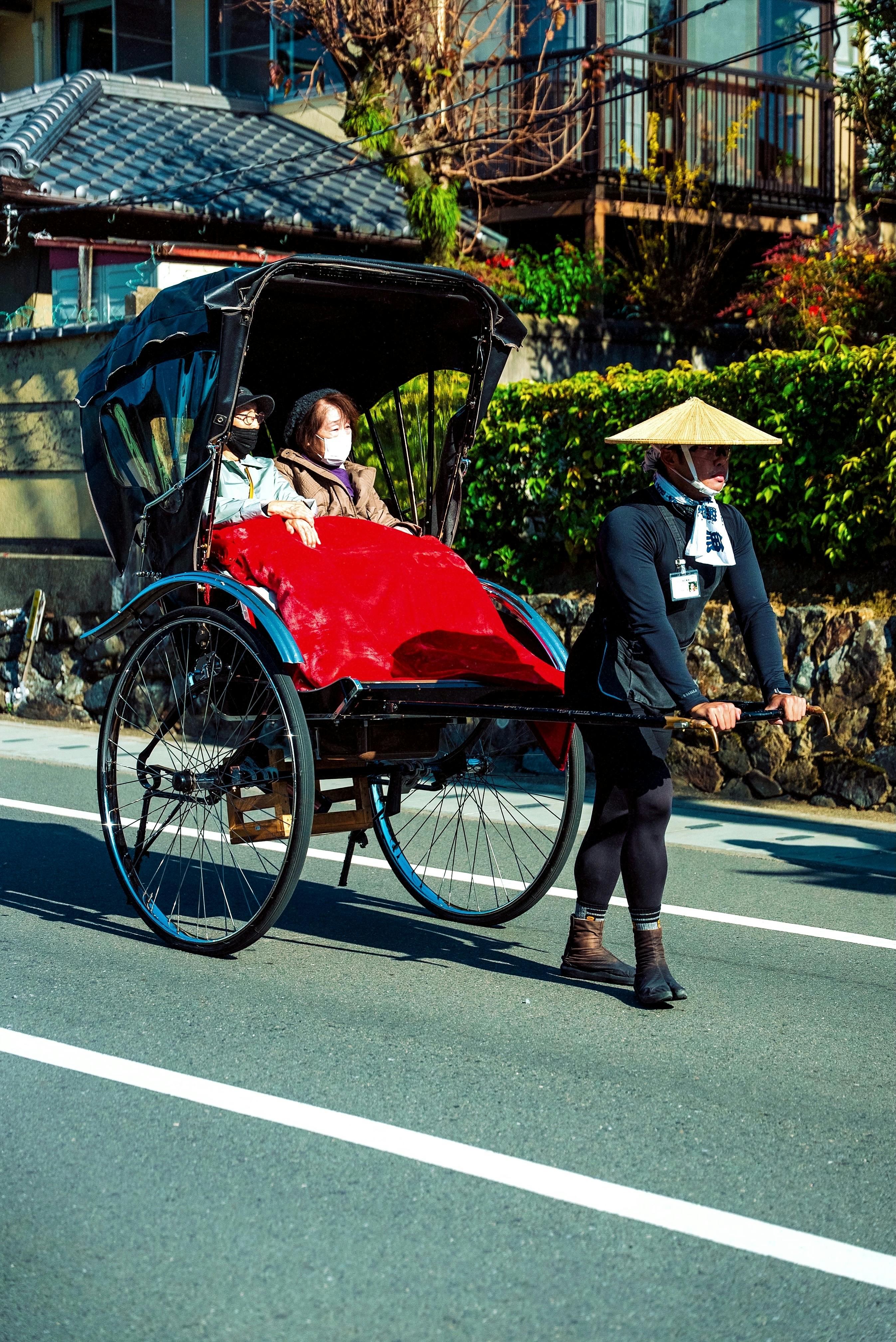 Traditional Rickshaw Ride Through Japanese Streets · Free Stock Photo
