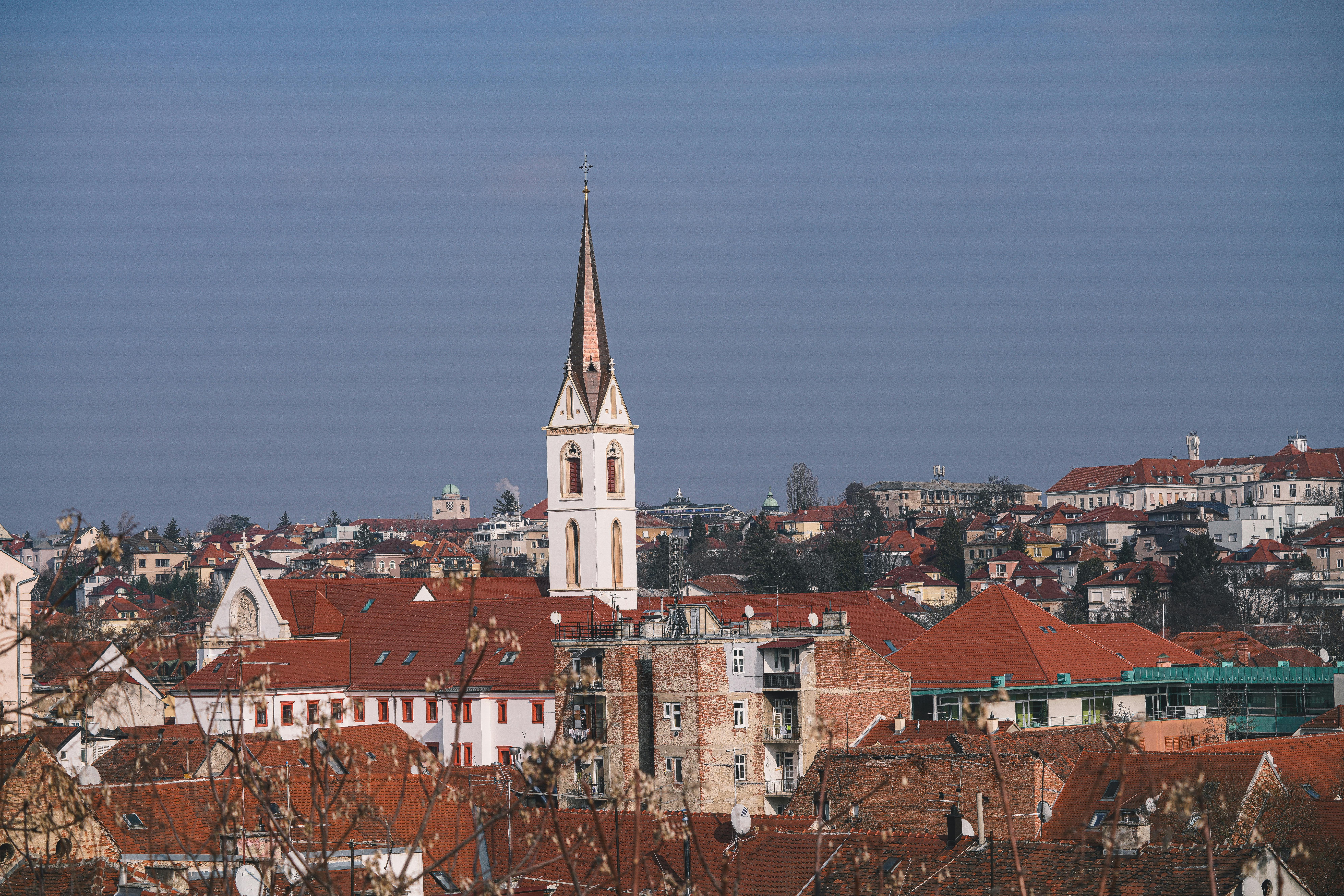Charming European Town with Red Rooftops and Church Spire · Free Stock ...