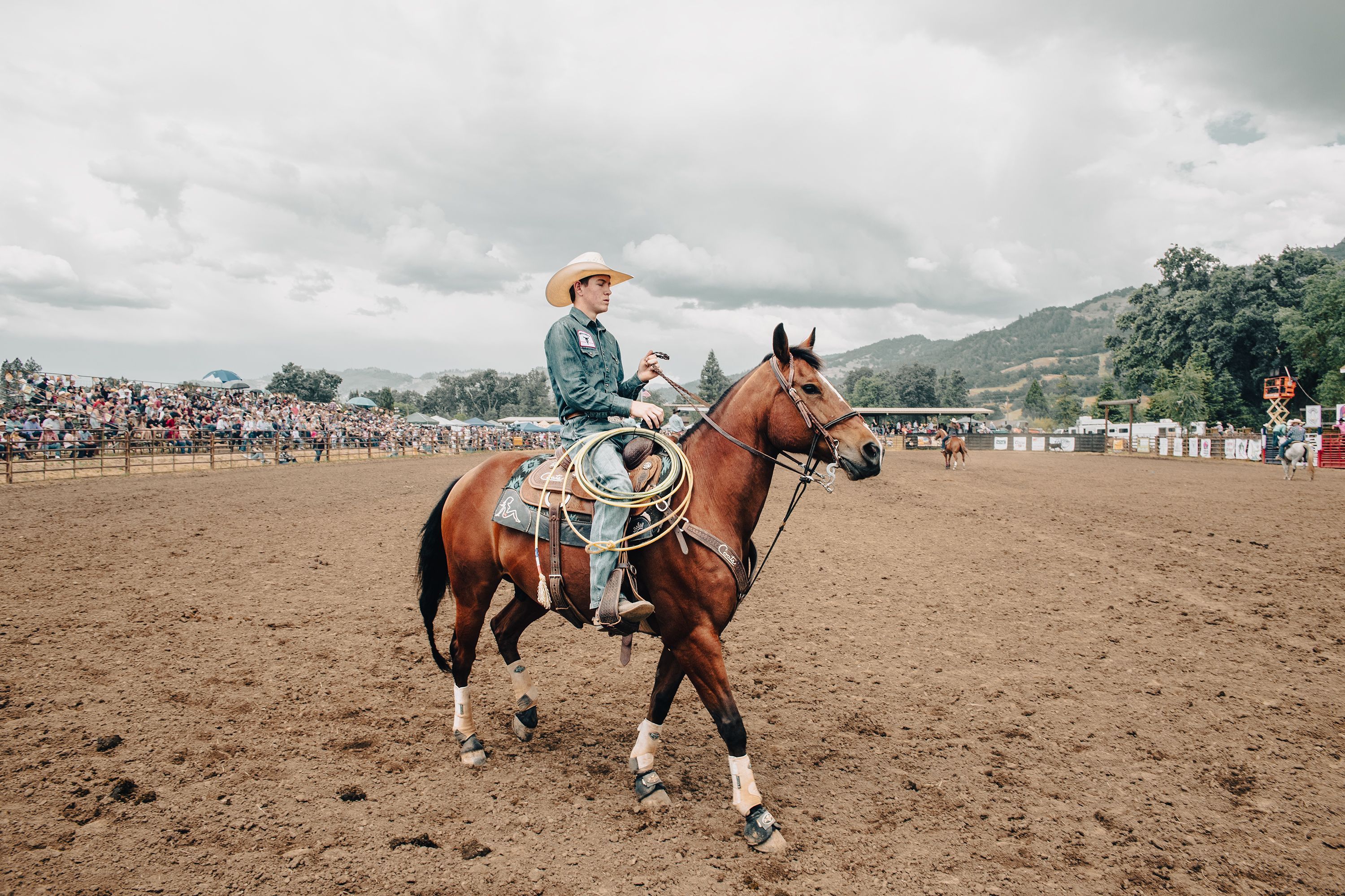 Rodeo Cowboy Riding in California Arena · Free Stock Photo