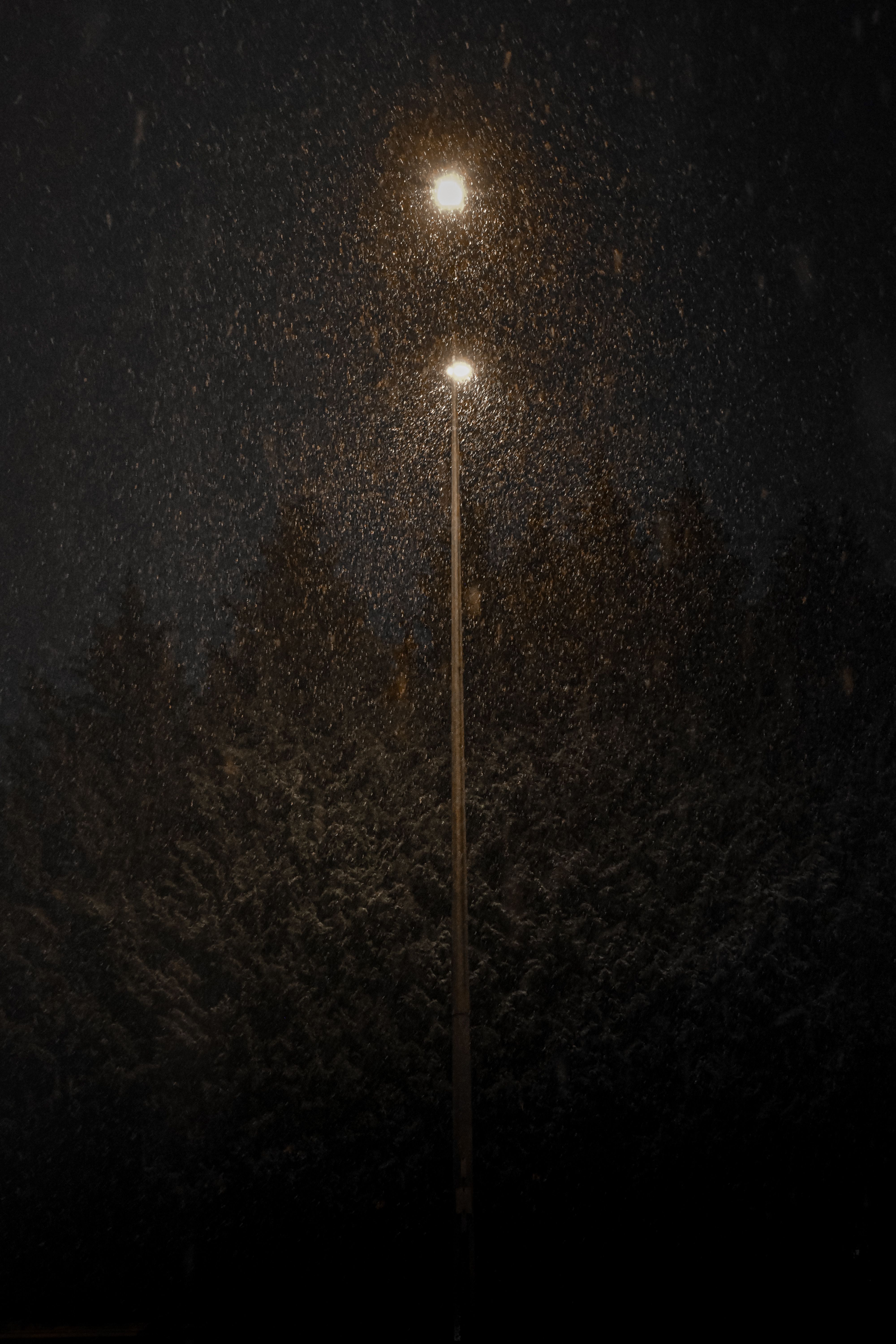Streetlamp Illuminating Snowy Night Scene · Free Stock Photo