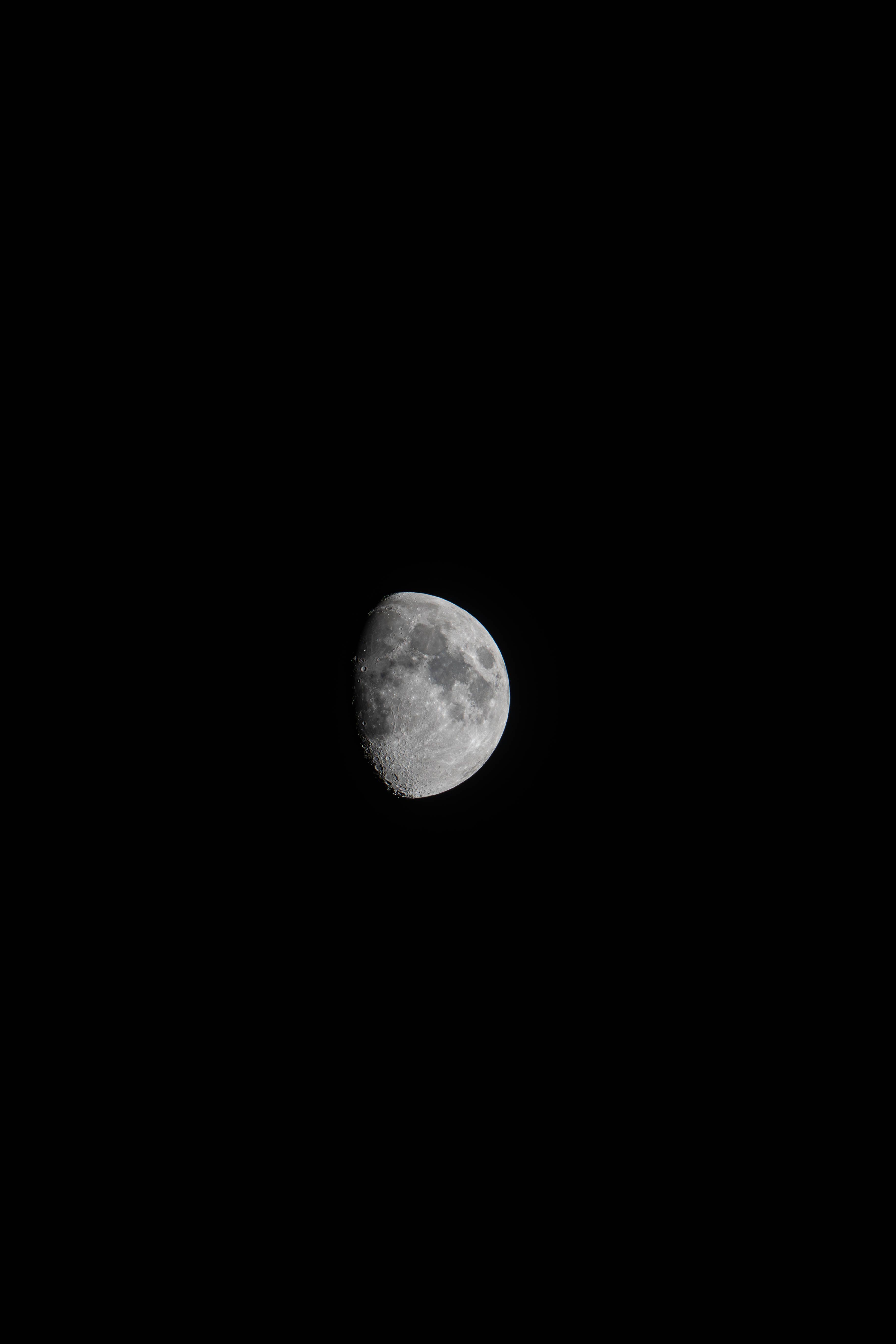 Half Moon Phase Against Dark Night Sky · Free Stock Photo