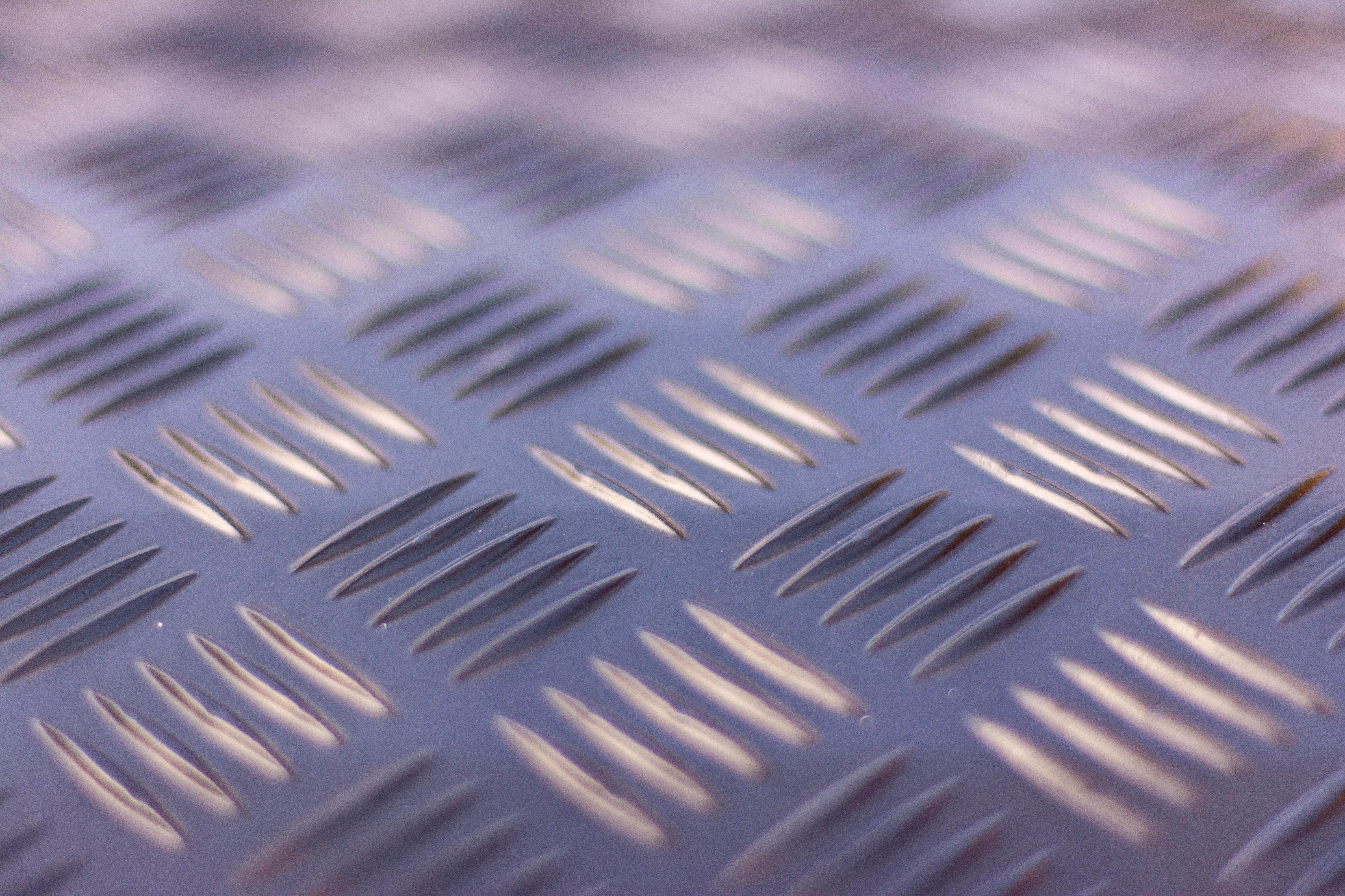 Close-Up of Checker Plate Metal Surface · Free Stock Photo