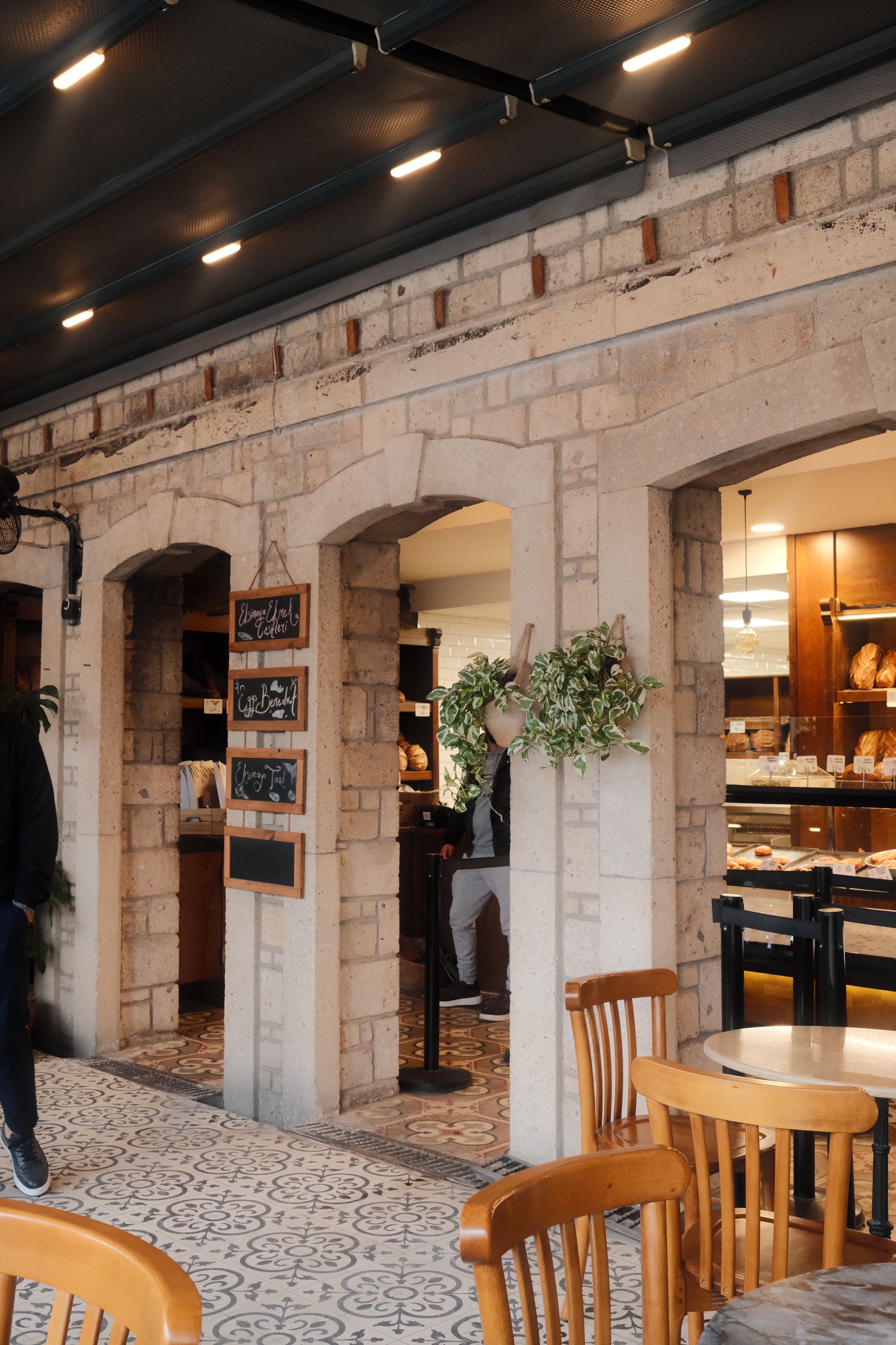 Cozy Outdoor Café with Rustic Stone Architecture · Free Stock Photo