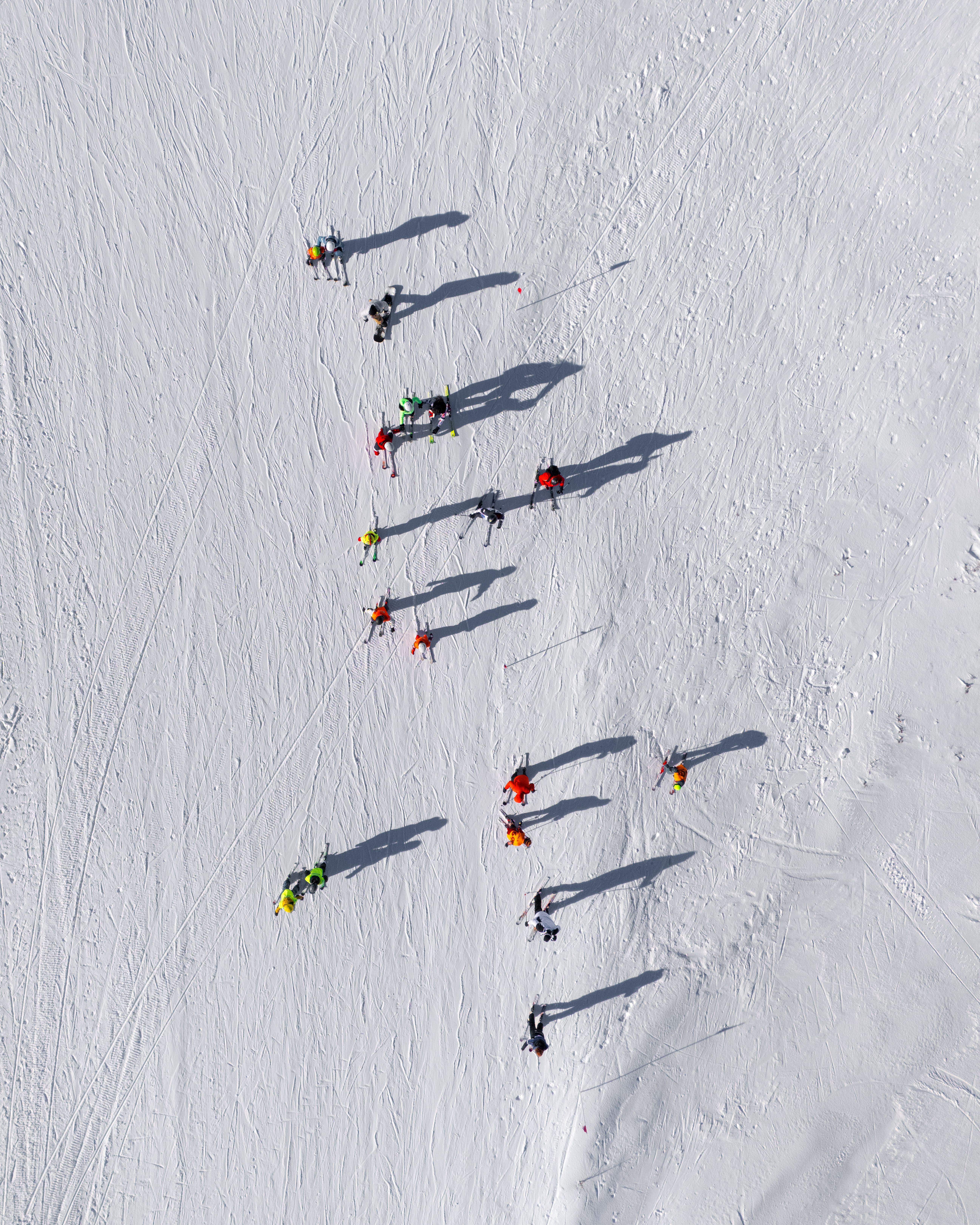 Aerial View of Skiers on a Snowy Slope · Free Stock Photo