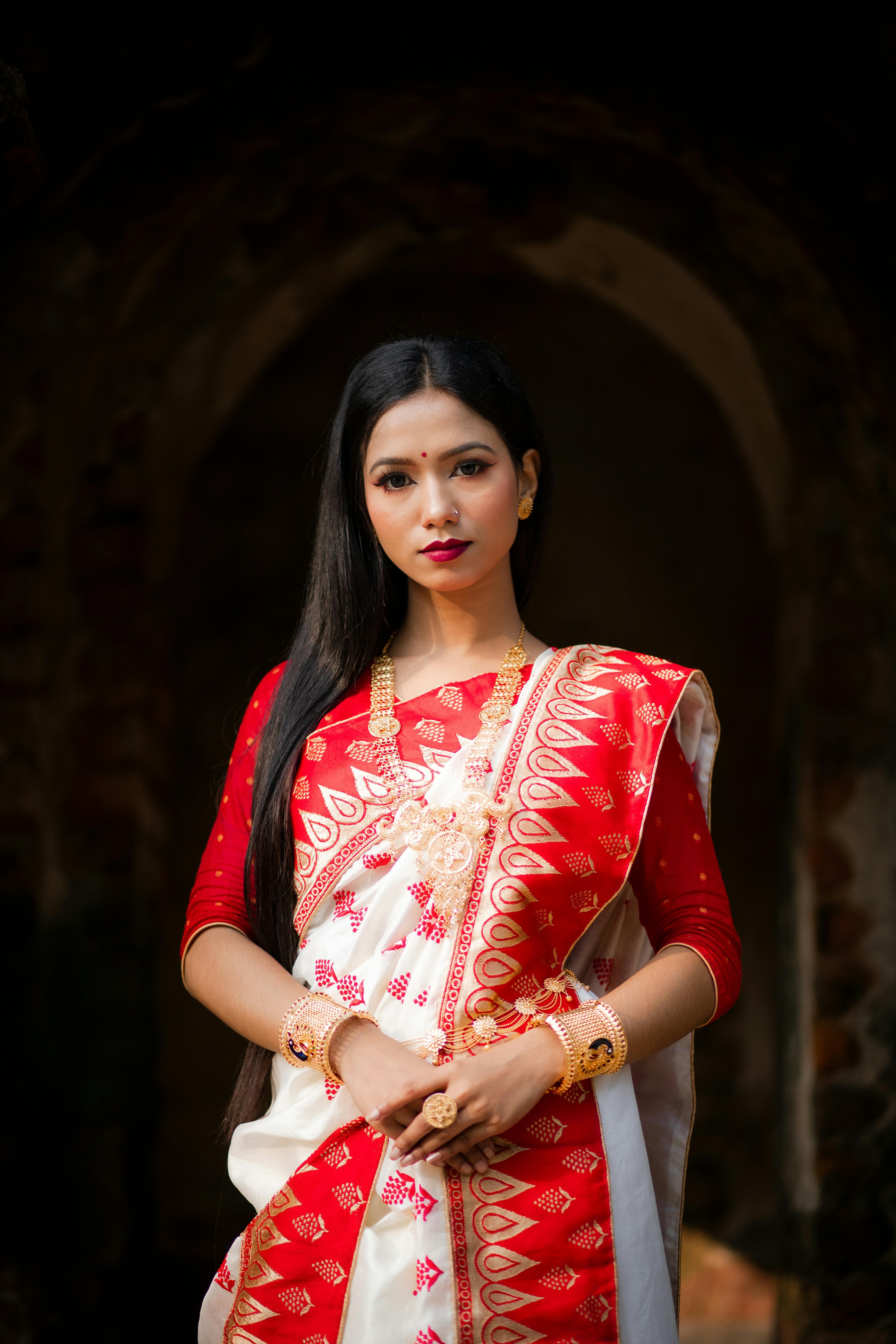 Elegant Woman in Traditional Red Sharee · Free Stock Photo