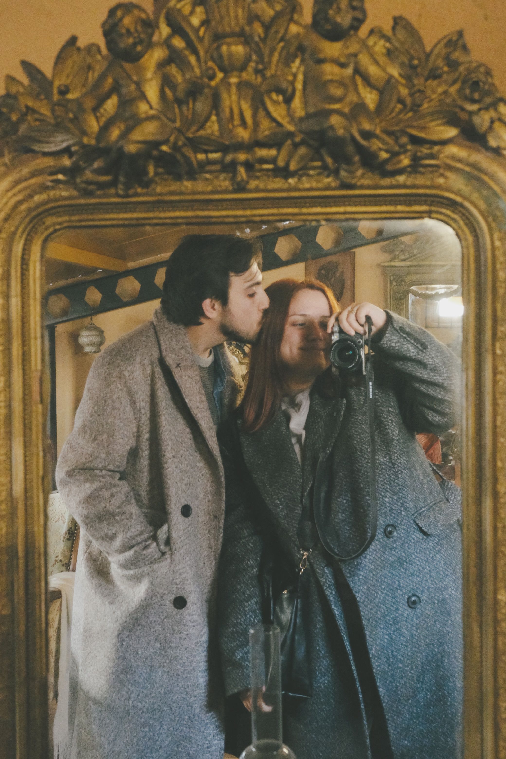 Couple Taking a Selfie in Antique Mirror Reflection · Free Stock Photo