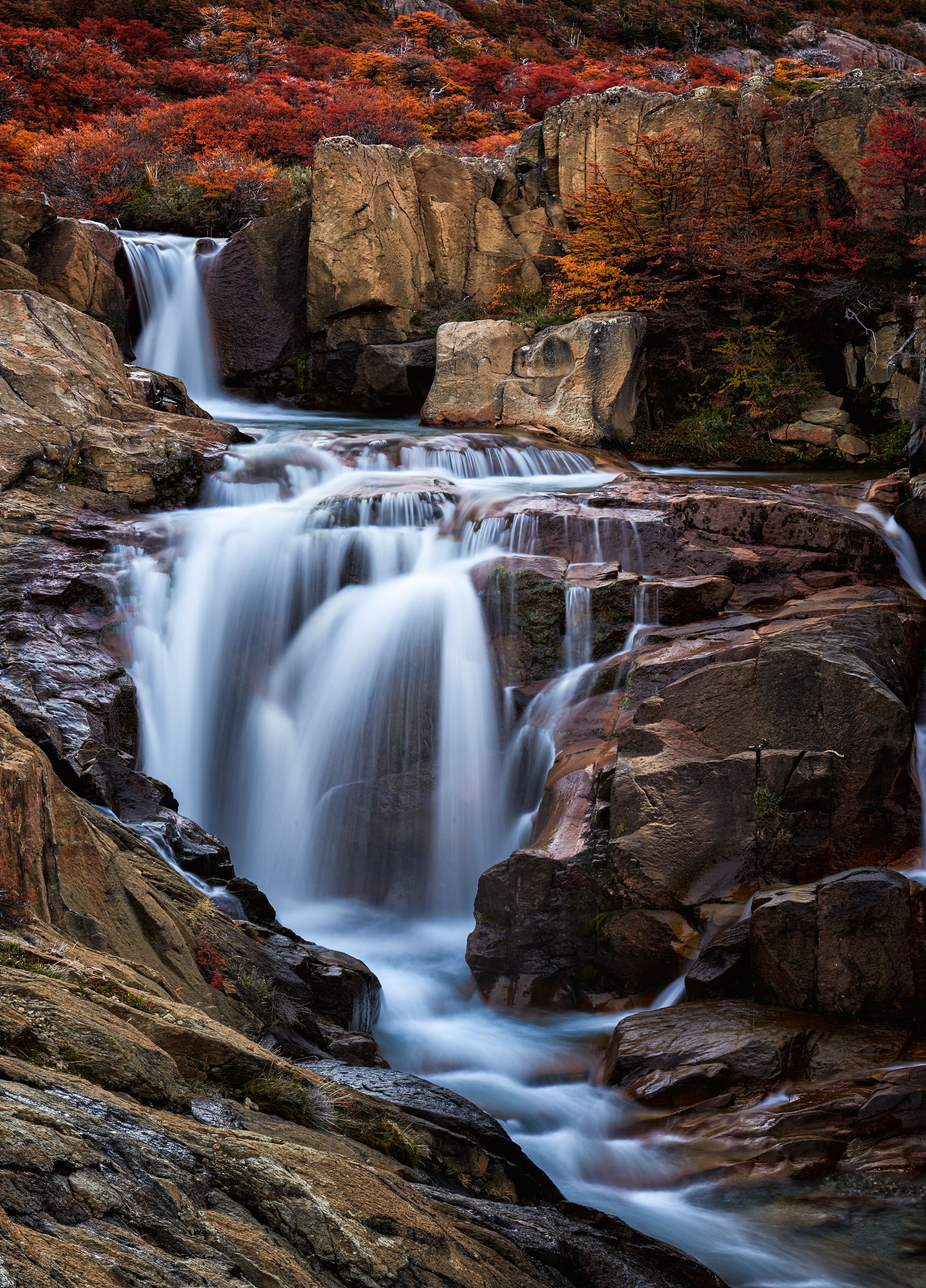 Scenic Waterfall in Autumn Forest Setting · Free Stock Photo