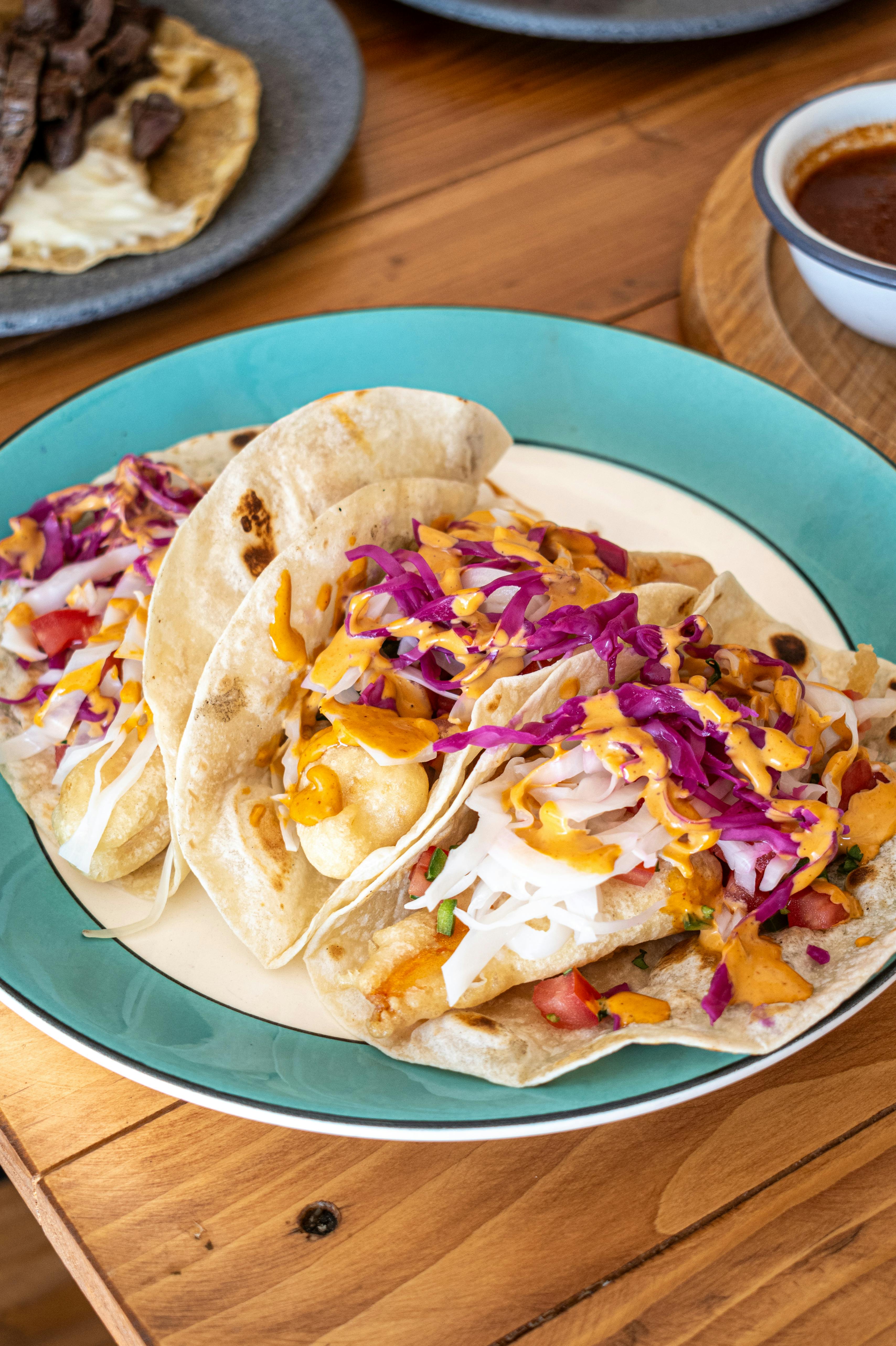 Delicious Shrimp Tacos with Vibrant Toppings · Free Stock Photo