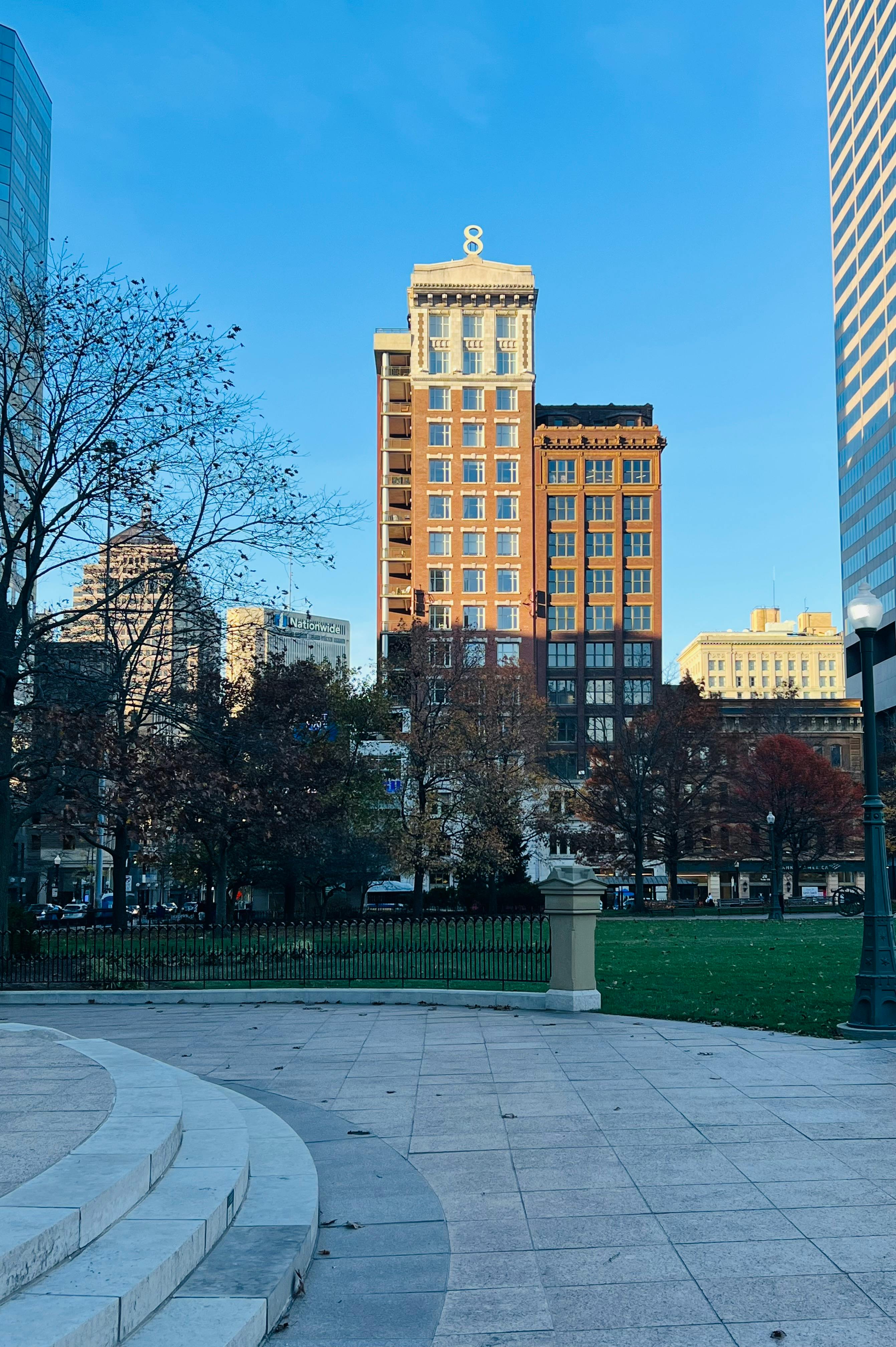 Urban Park View with Tall Brick Building at Daytime · Free Stock Photo