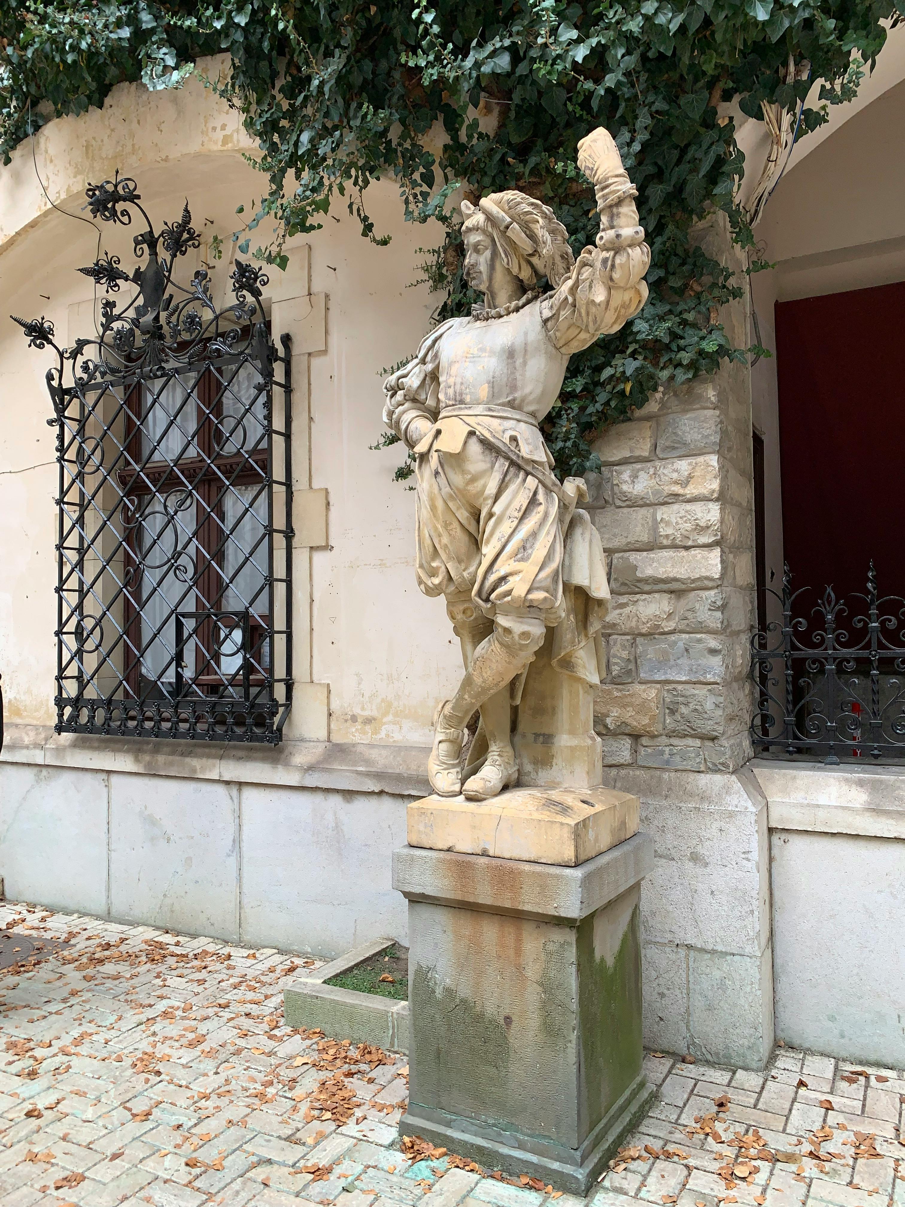Historical Stone Statue in Romanian Courtyard · Free Stock Photo