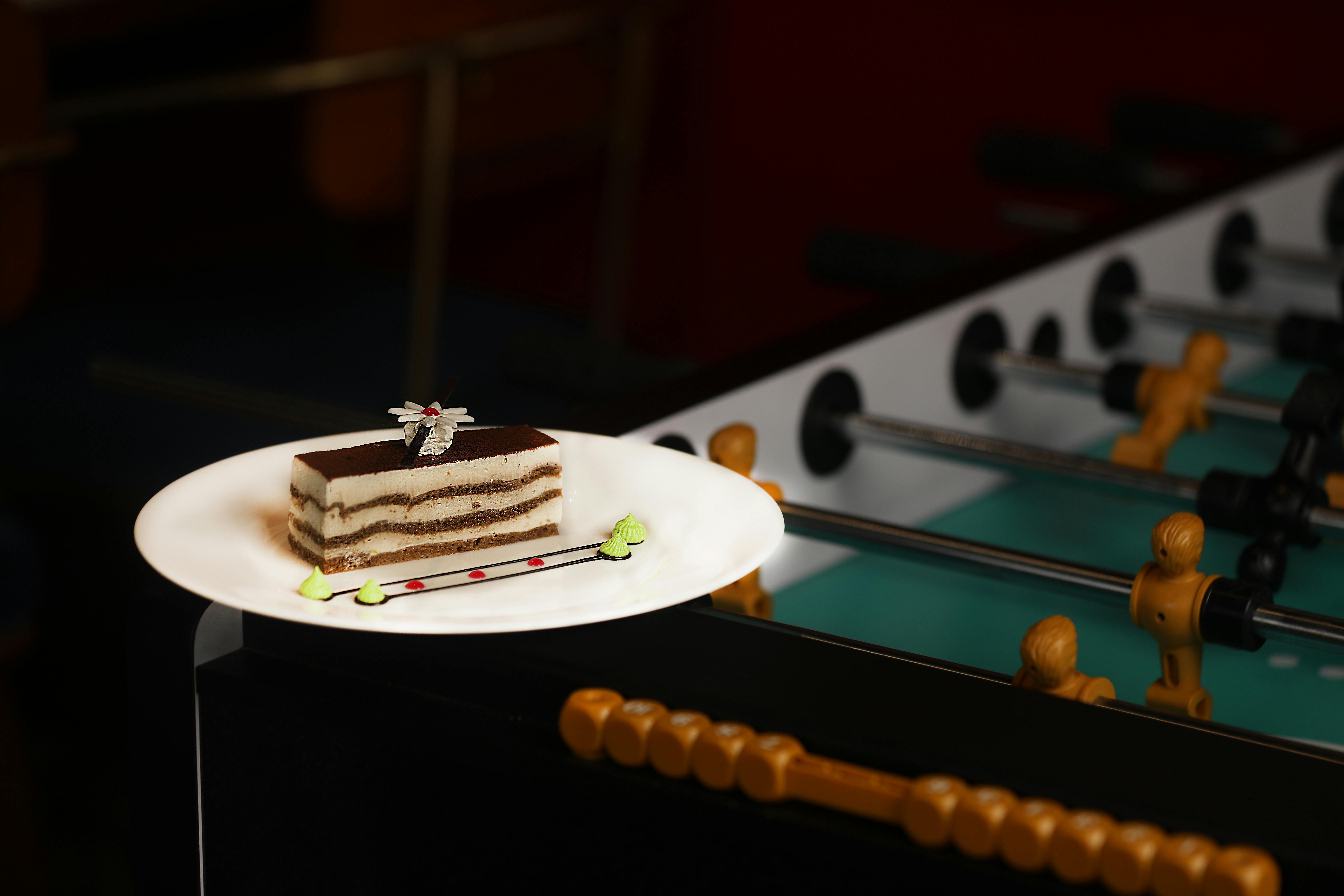 Tiramisu Dessert on Foosball Table in Bengaluru · Free Stock Photo