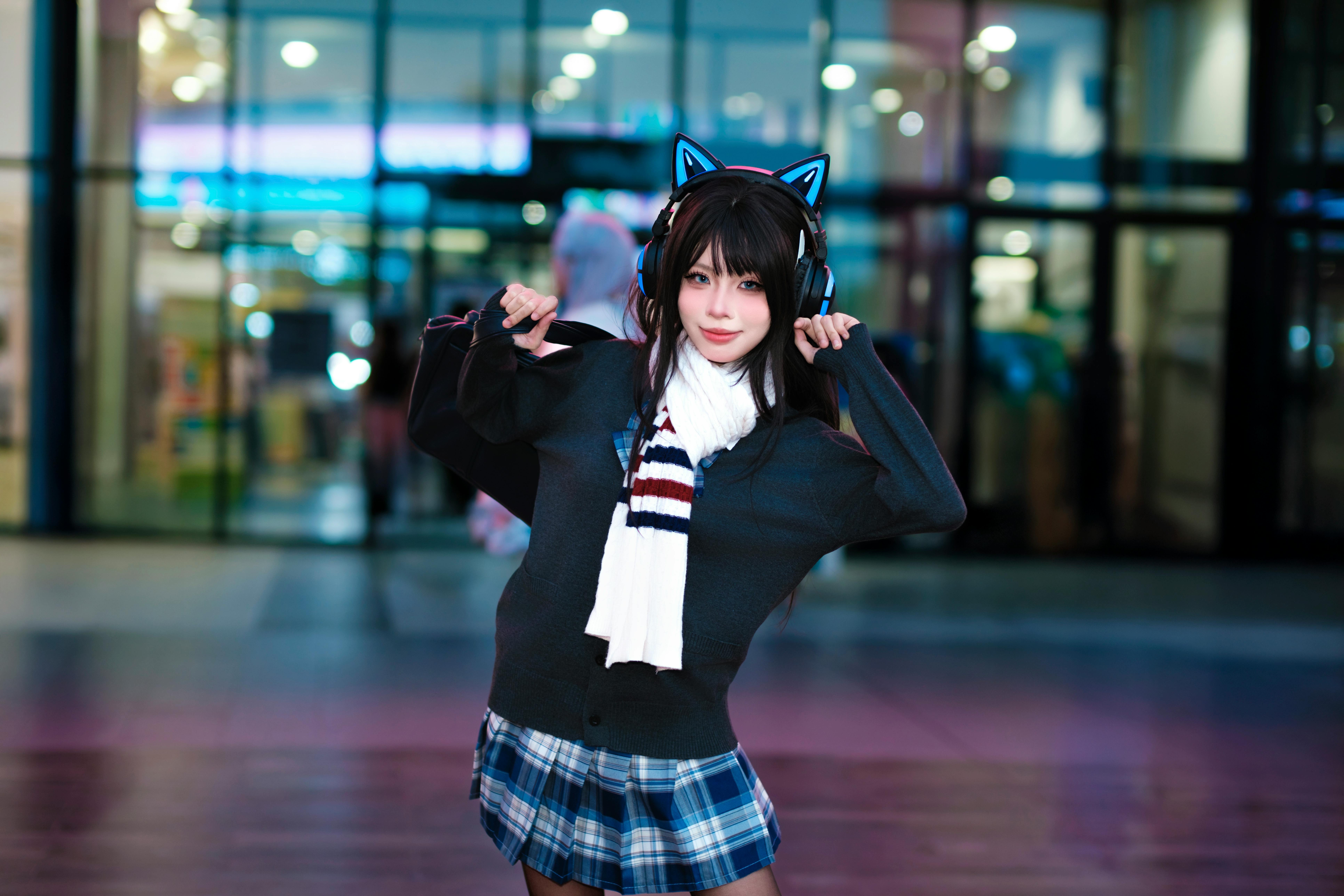 Young Woman Posing with Headphones and Cat Ears · Free Stock Photo