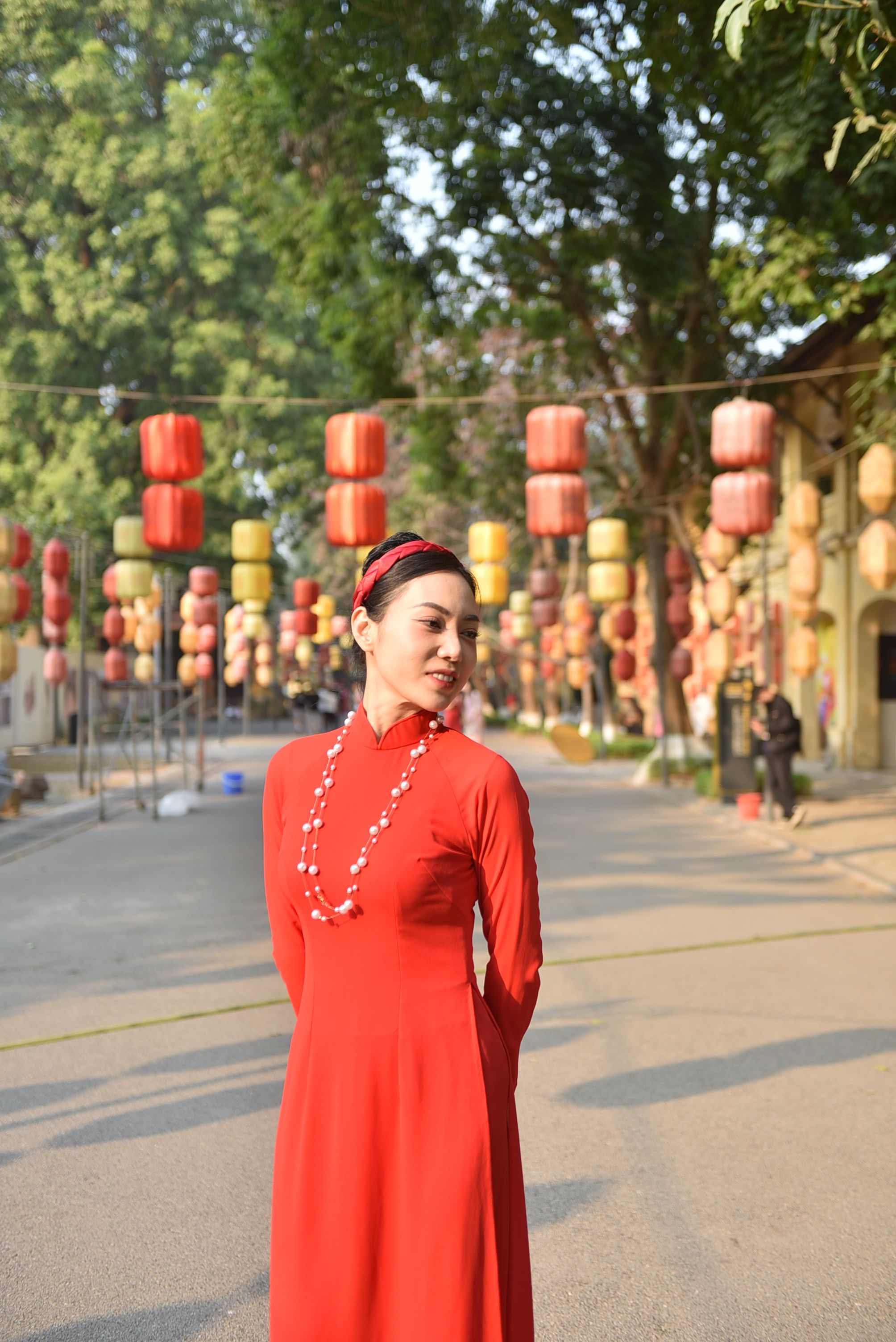 Young Woman in Red Dress Amidst Festive Lanterns · Free Stock Photo