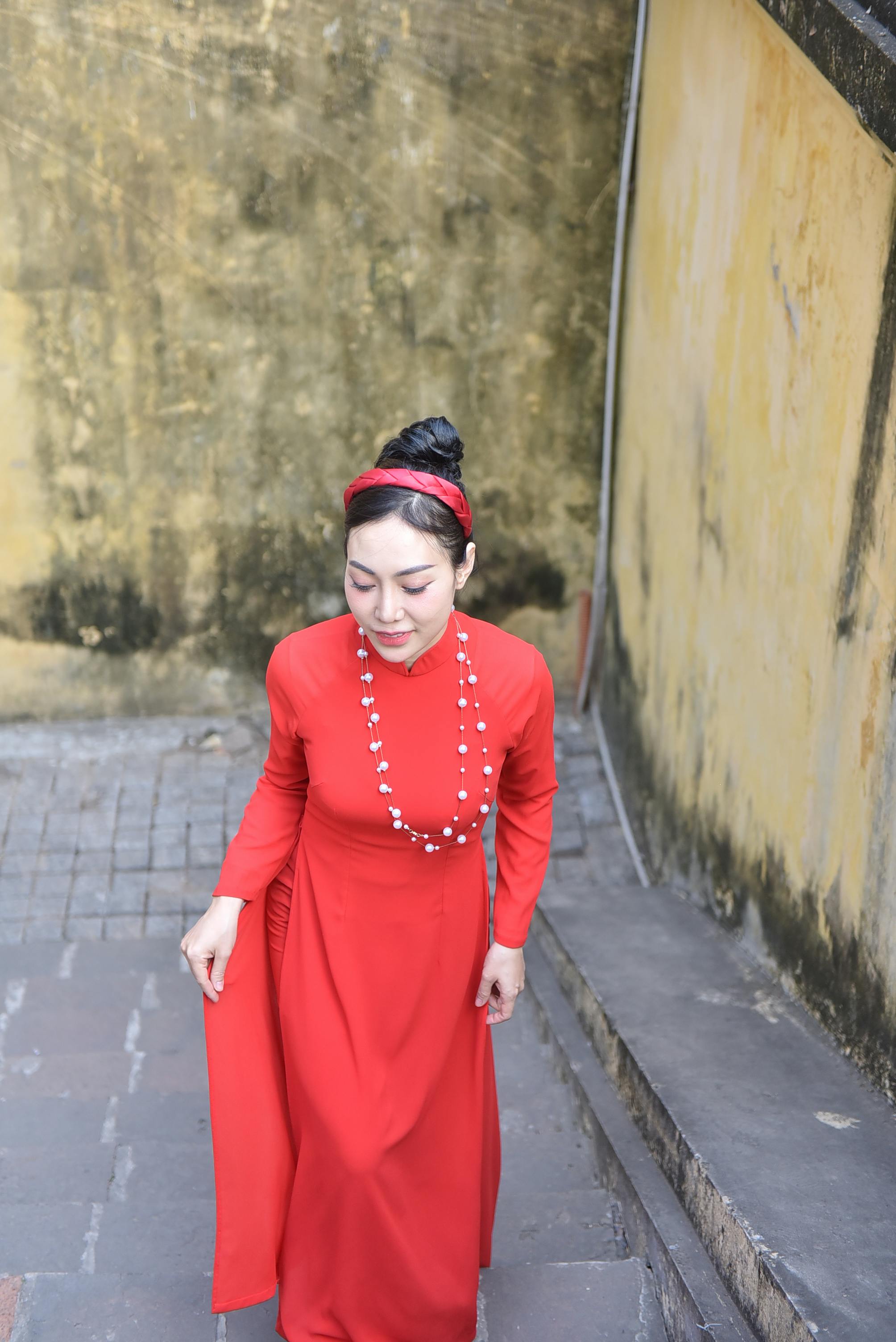 Woman in Traditional Red Dress Ascending Steps Outdoors · Free Stock Photo