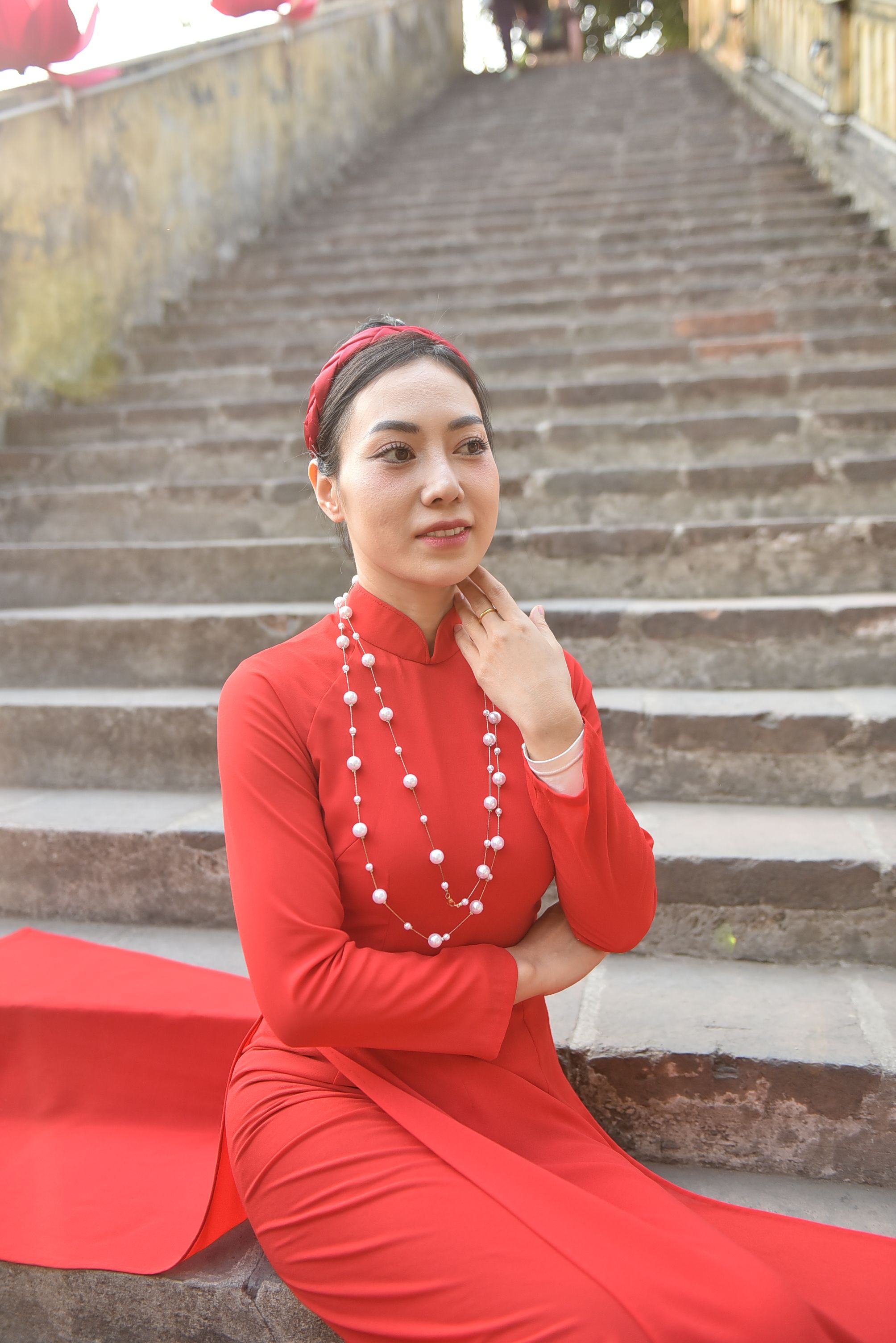 Woman in Red Dress Posing on Stone Steps · Free Stock Photo