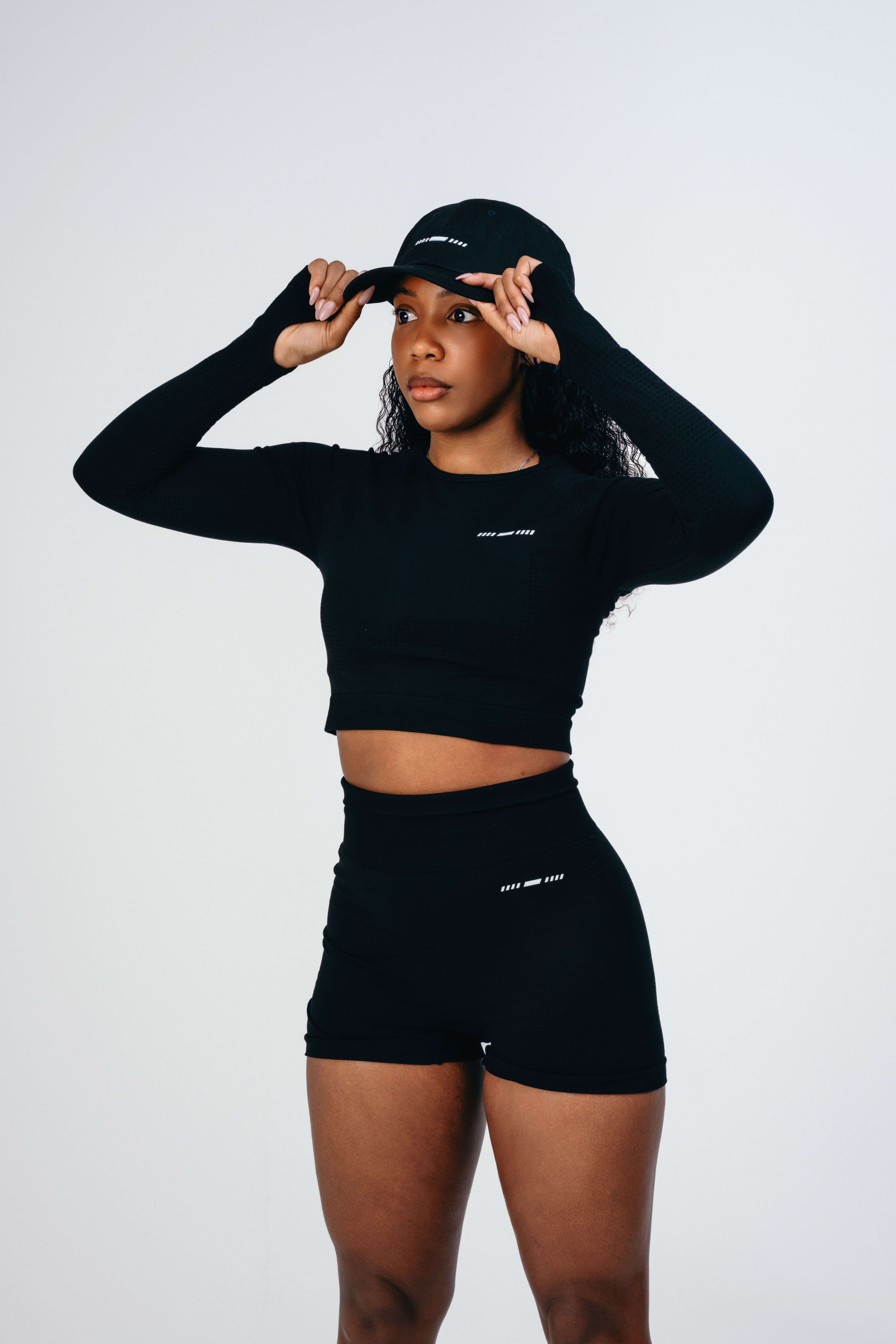 Trendy Black Activewear Look in Studio Setting · Free Stock Photo