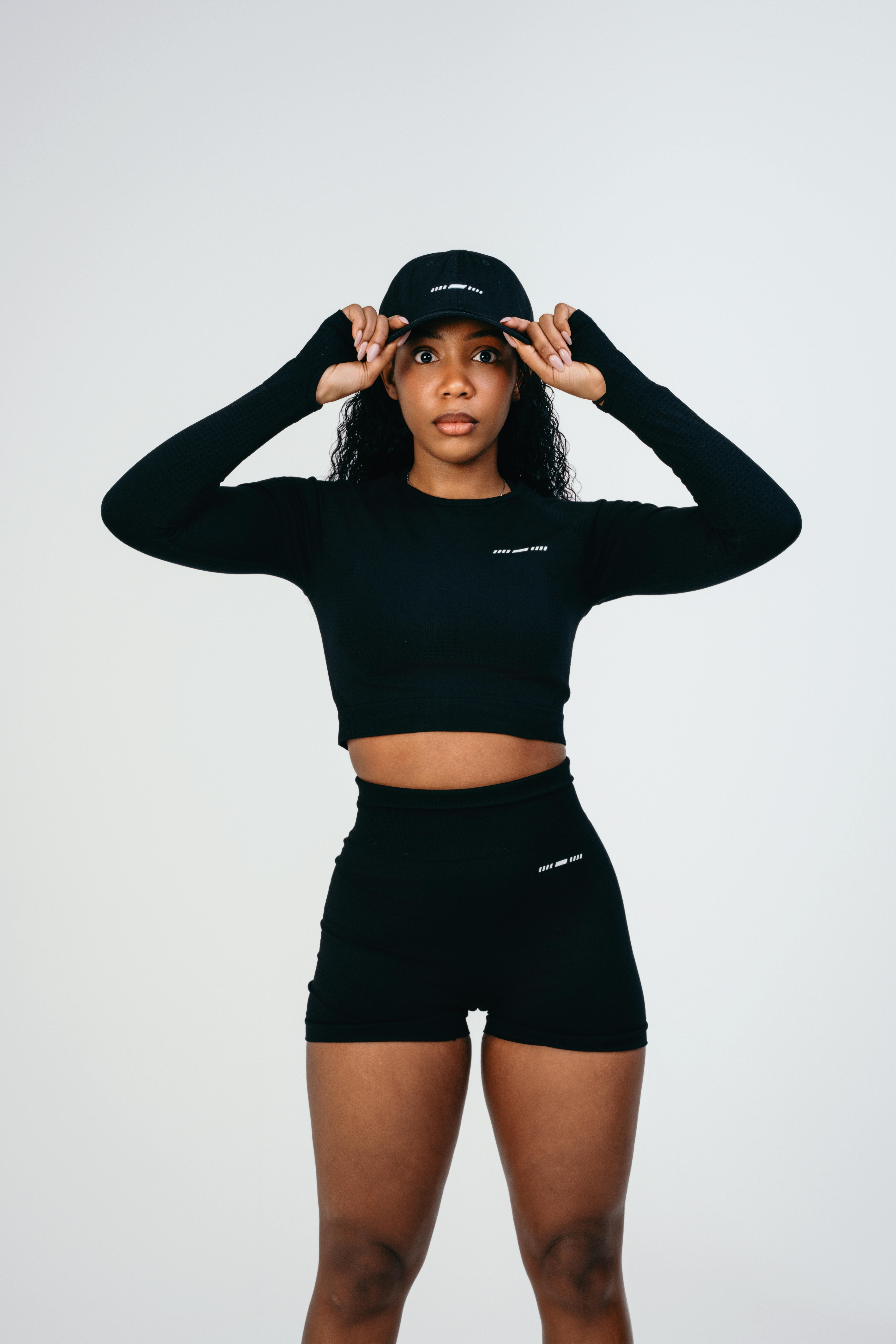 Stylish Fitness Model in Black Activewear · Free Stock Photo