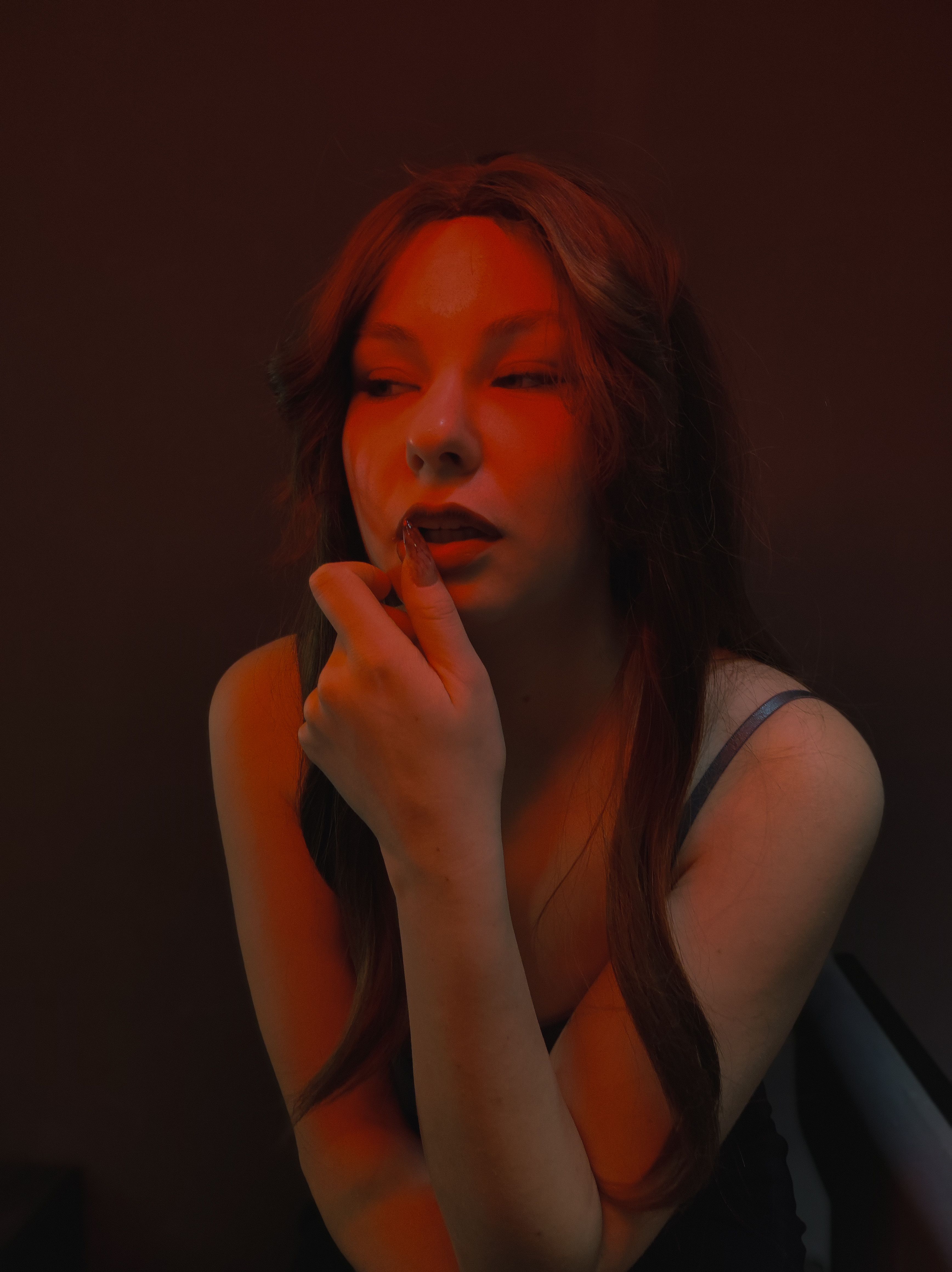 Moody Portrait of a Woman in Red Lighting · Free Stock Photo