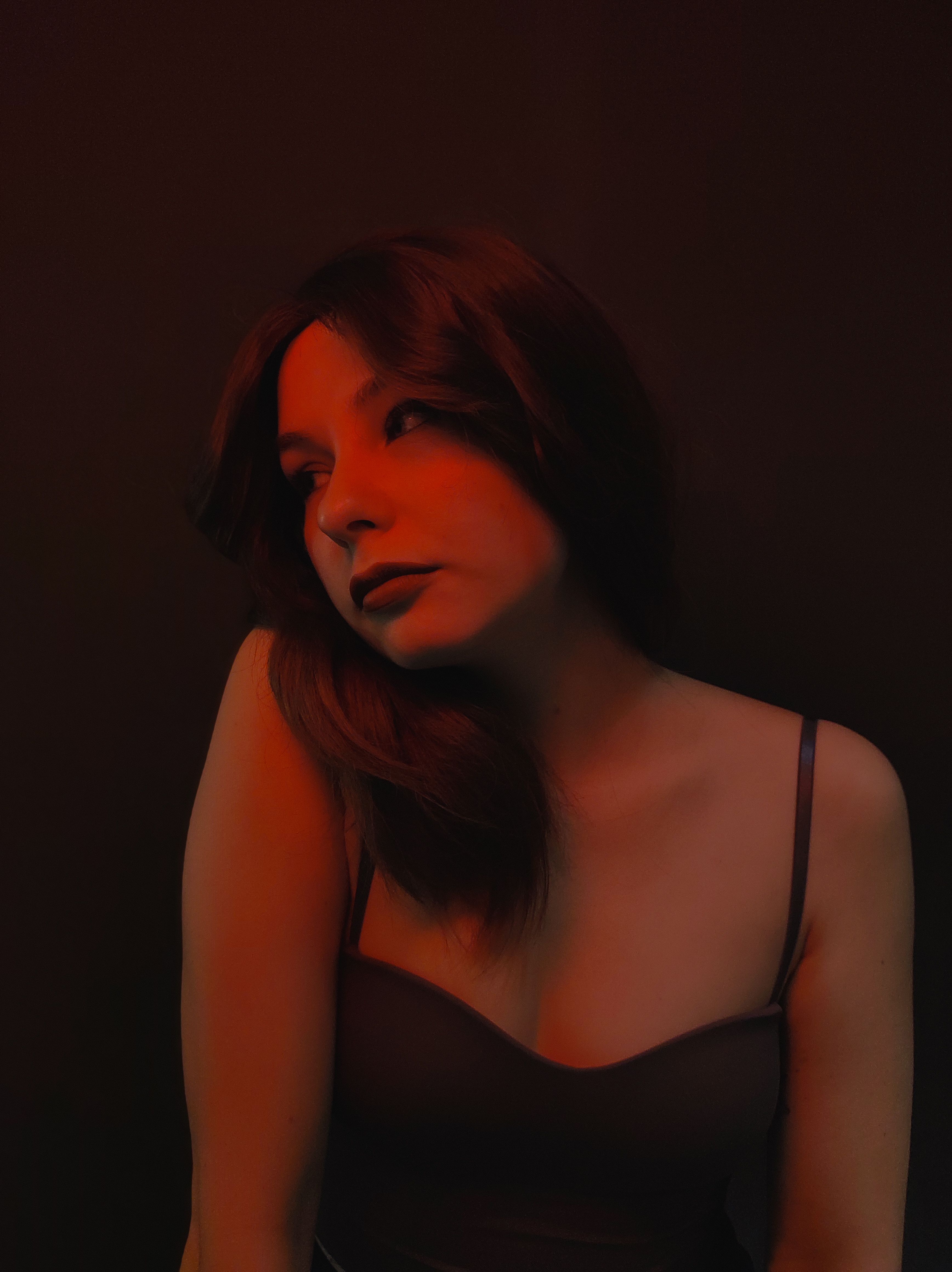 Moody Portrait of Woman in Red Lighting · Free Stock Photo