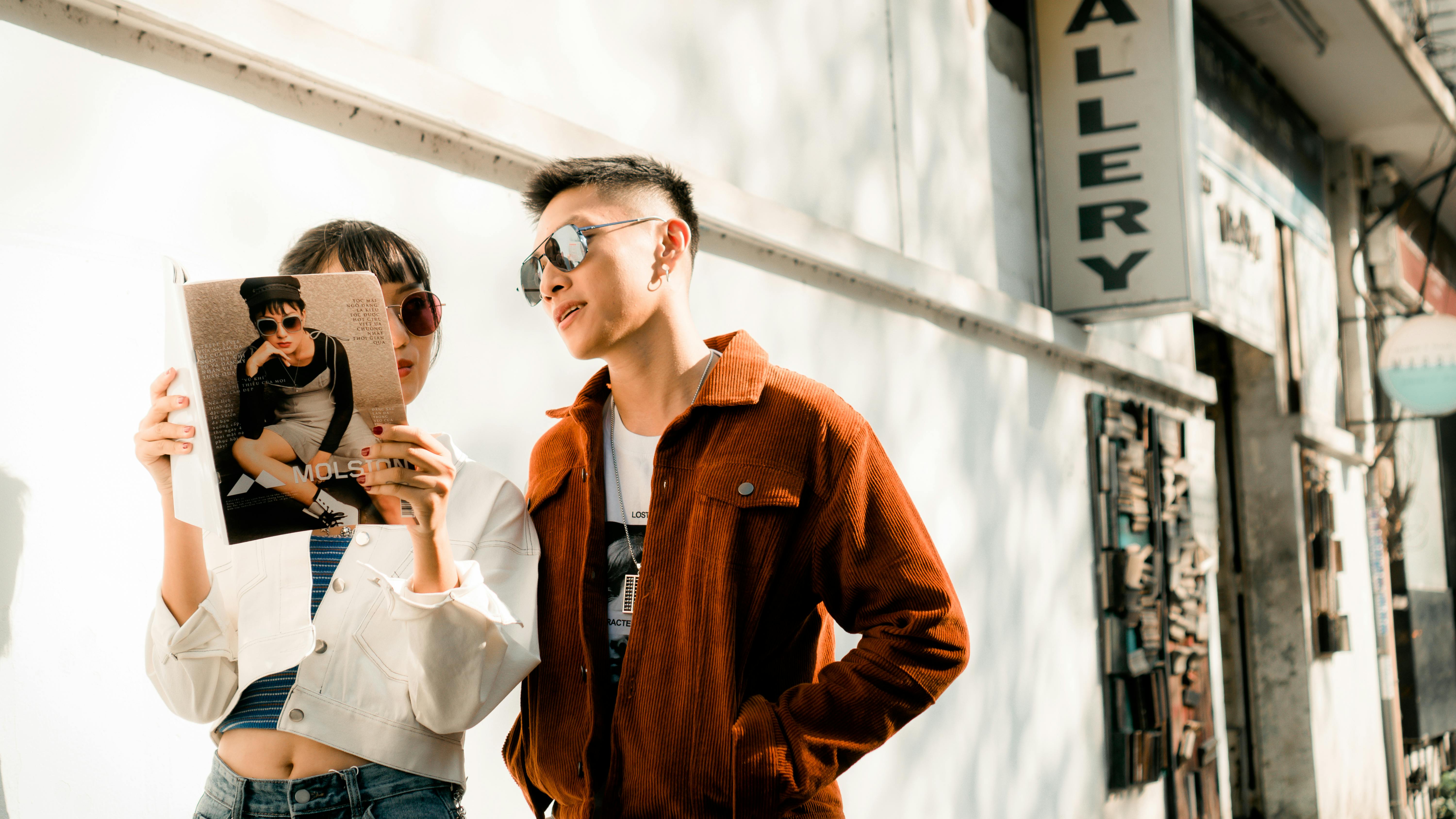 Woman Holding Magazine · Free Stock Photo