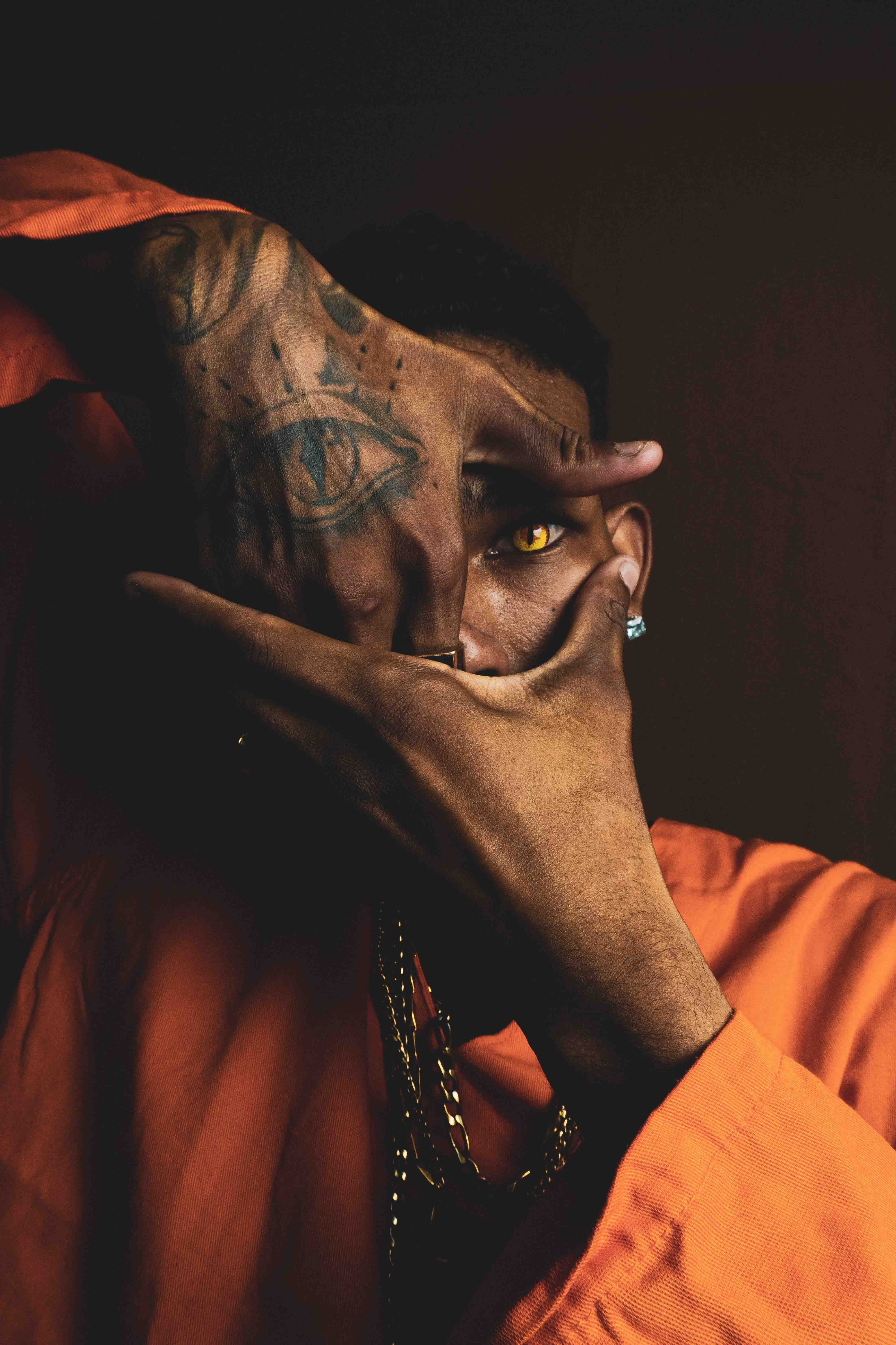 Artistic Portrait with Tattoos and Yellow Eyes · Free Stock Photo