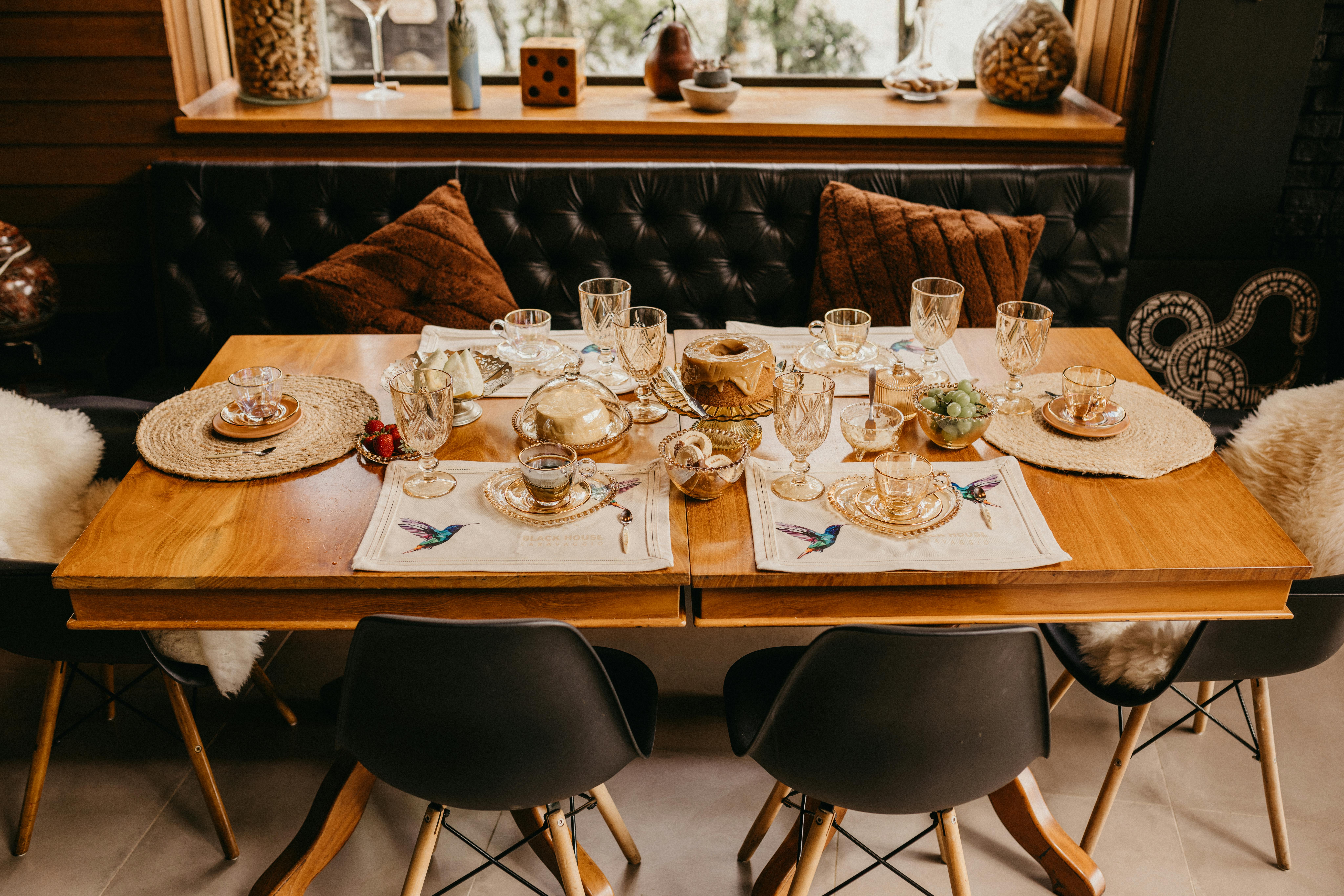 Cozy Dining Table Setup in Warm Interior Setting · Free Stock Photo