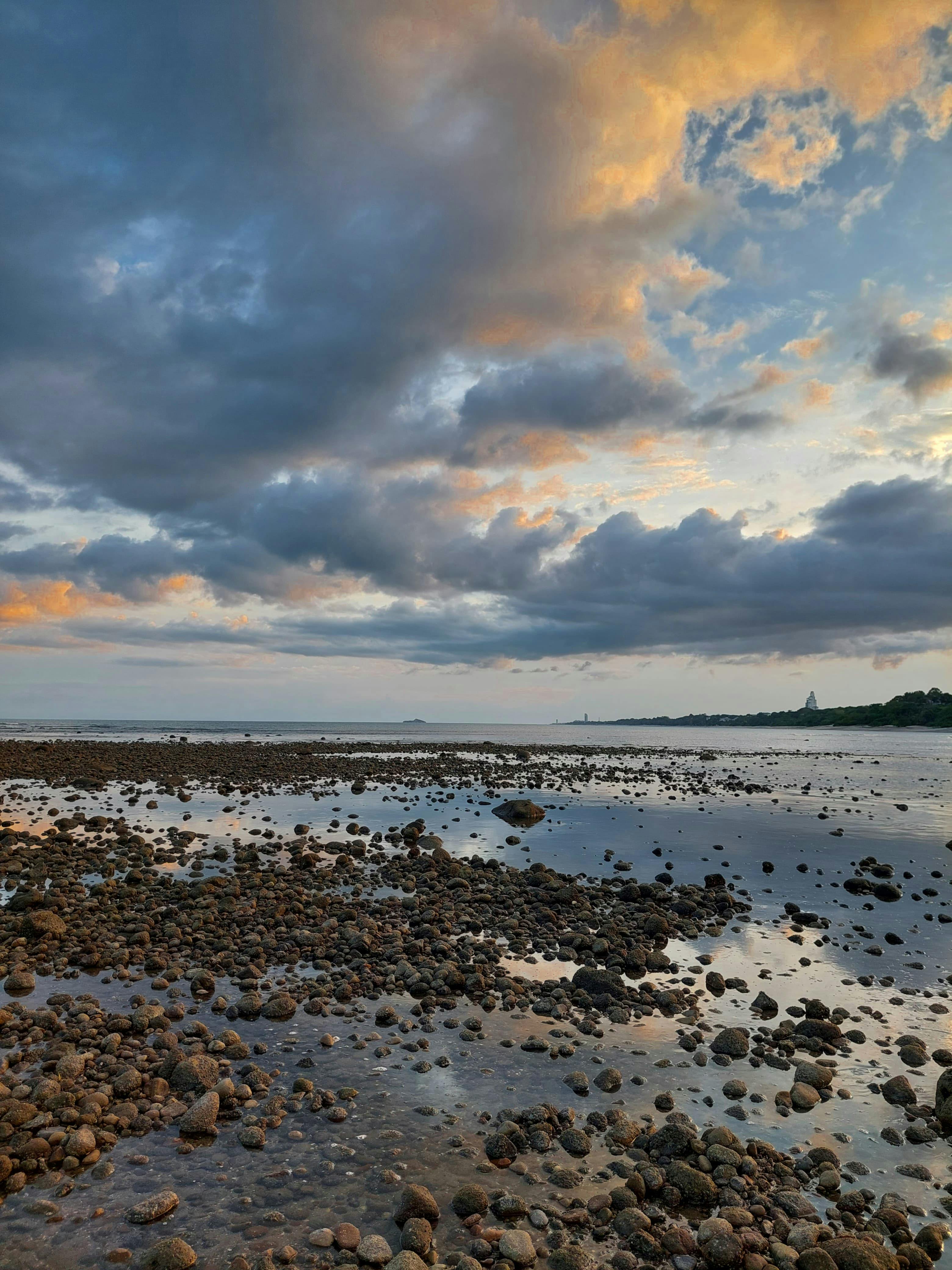 Scenic Rocky Beach Landscape at Sunset · Free Stock Photo