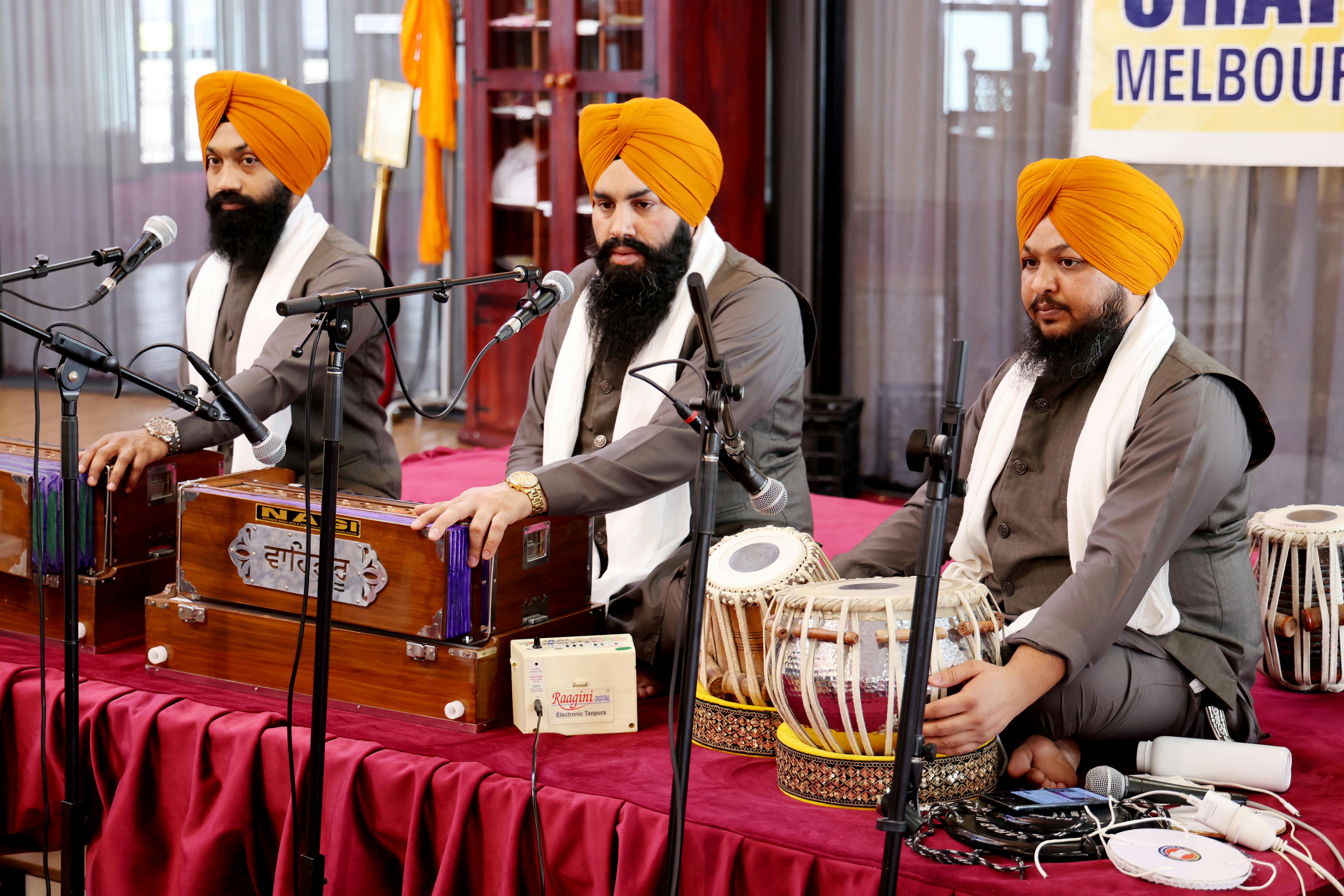 Sikh Musicians Performing Traditional Kirtan · Free Stock Photo