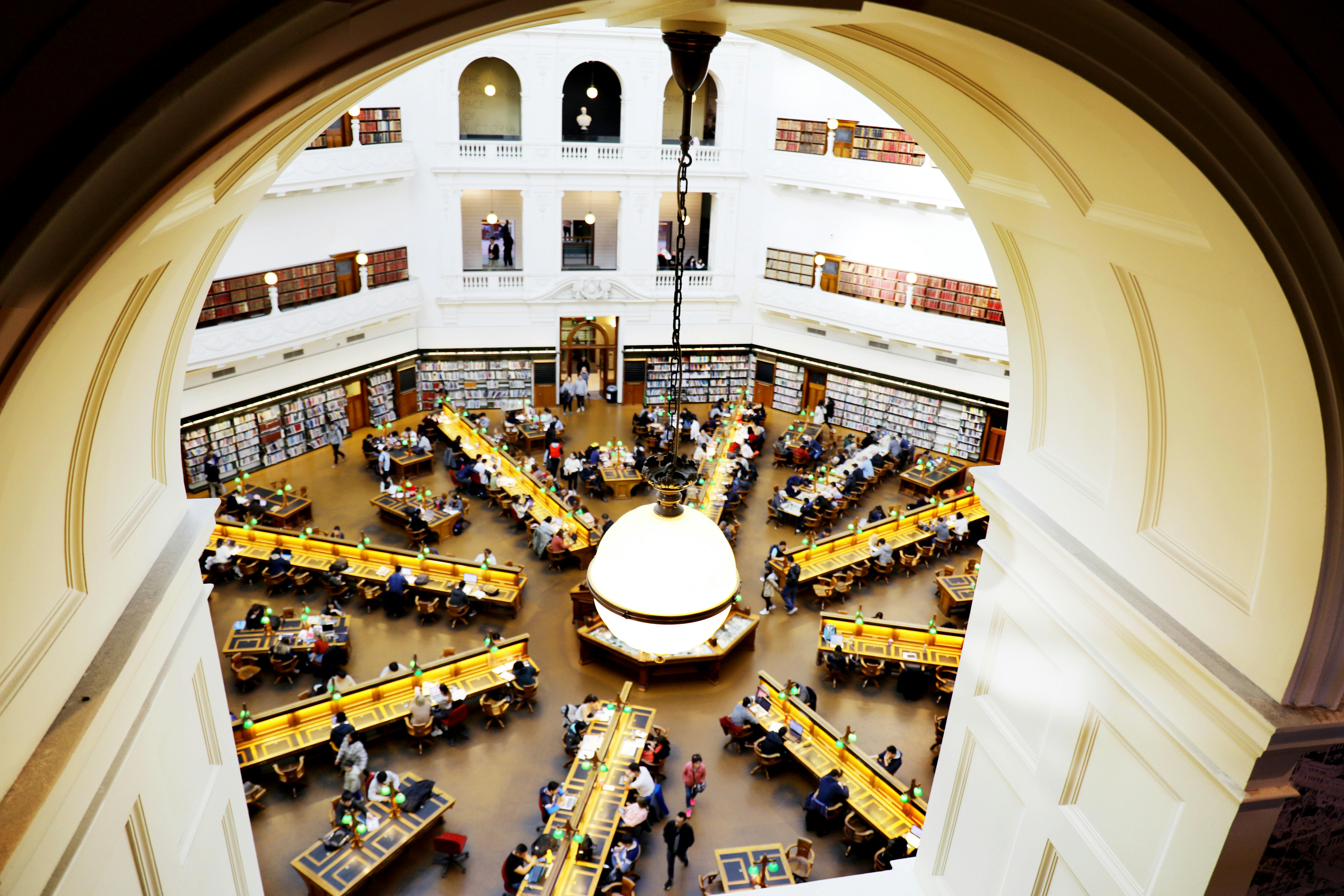 Aerial View of Spacious Library Interior with People · Free Stock Photo