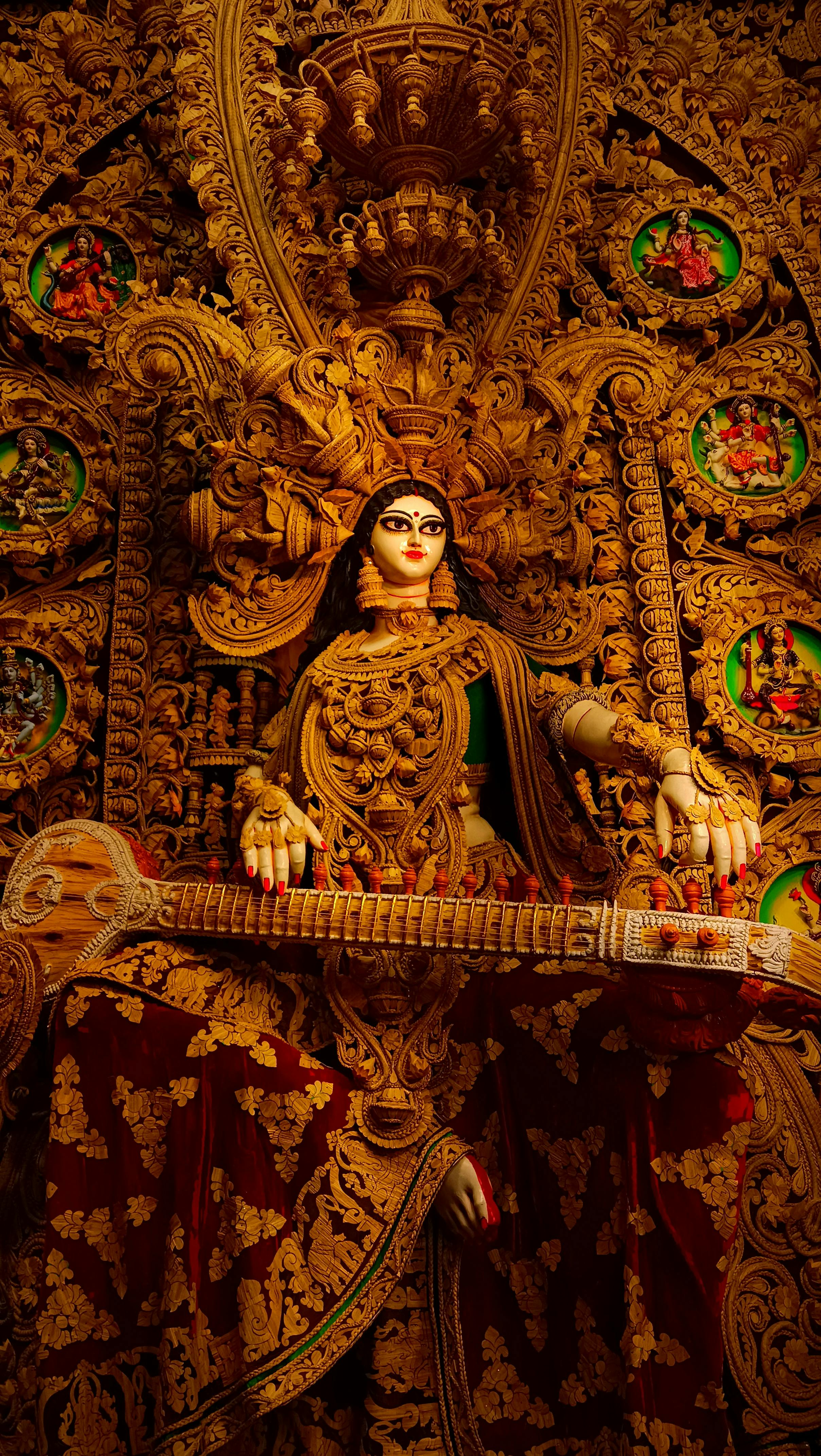 Intricate Goddess Sculpture with Musical Instrument · Free Stock Photo