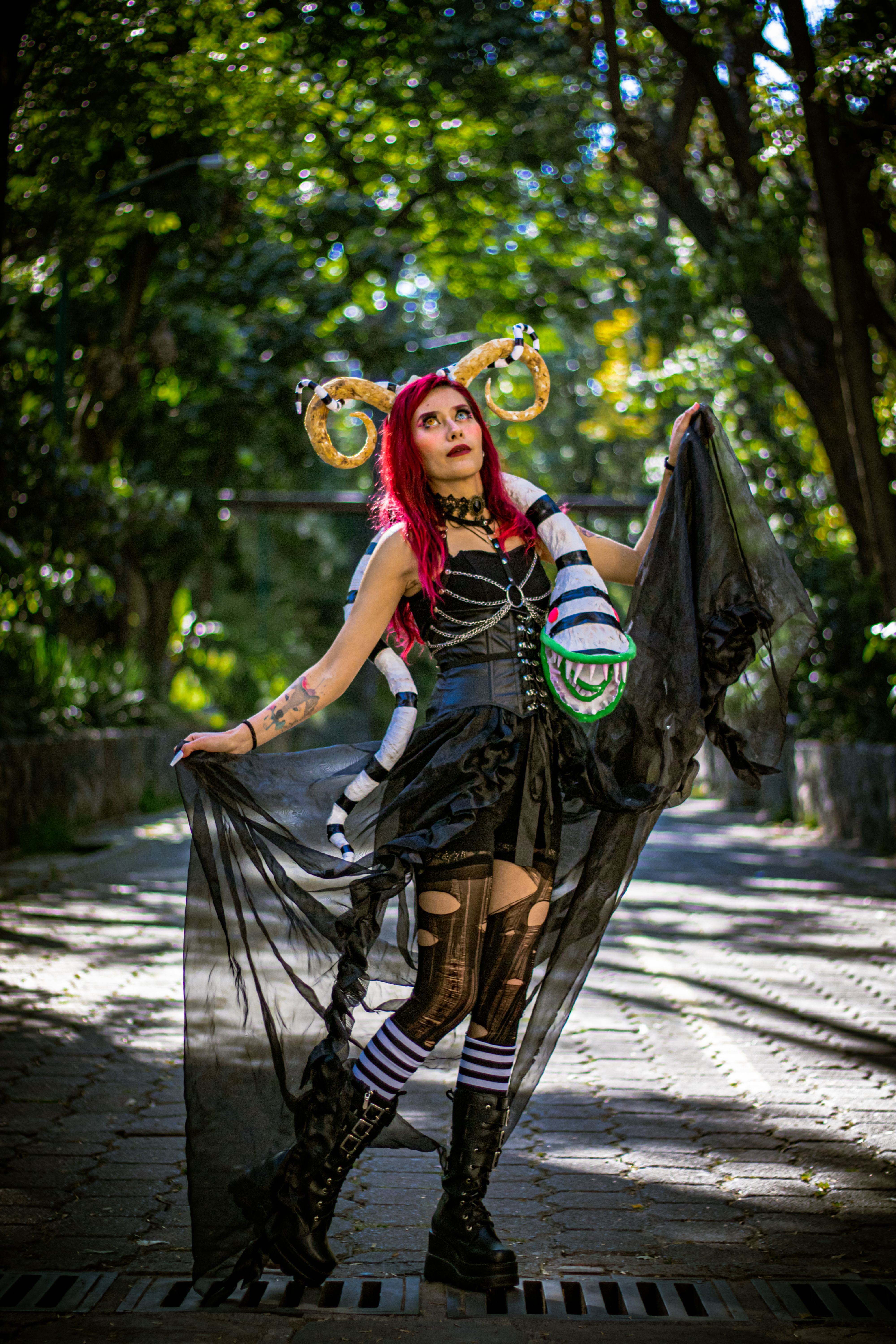 Creative Cosplay in Park Setting with Artistic Makeup · Free Stock Photo