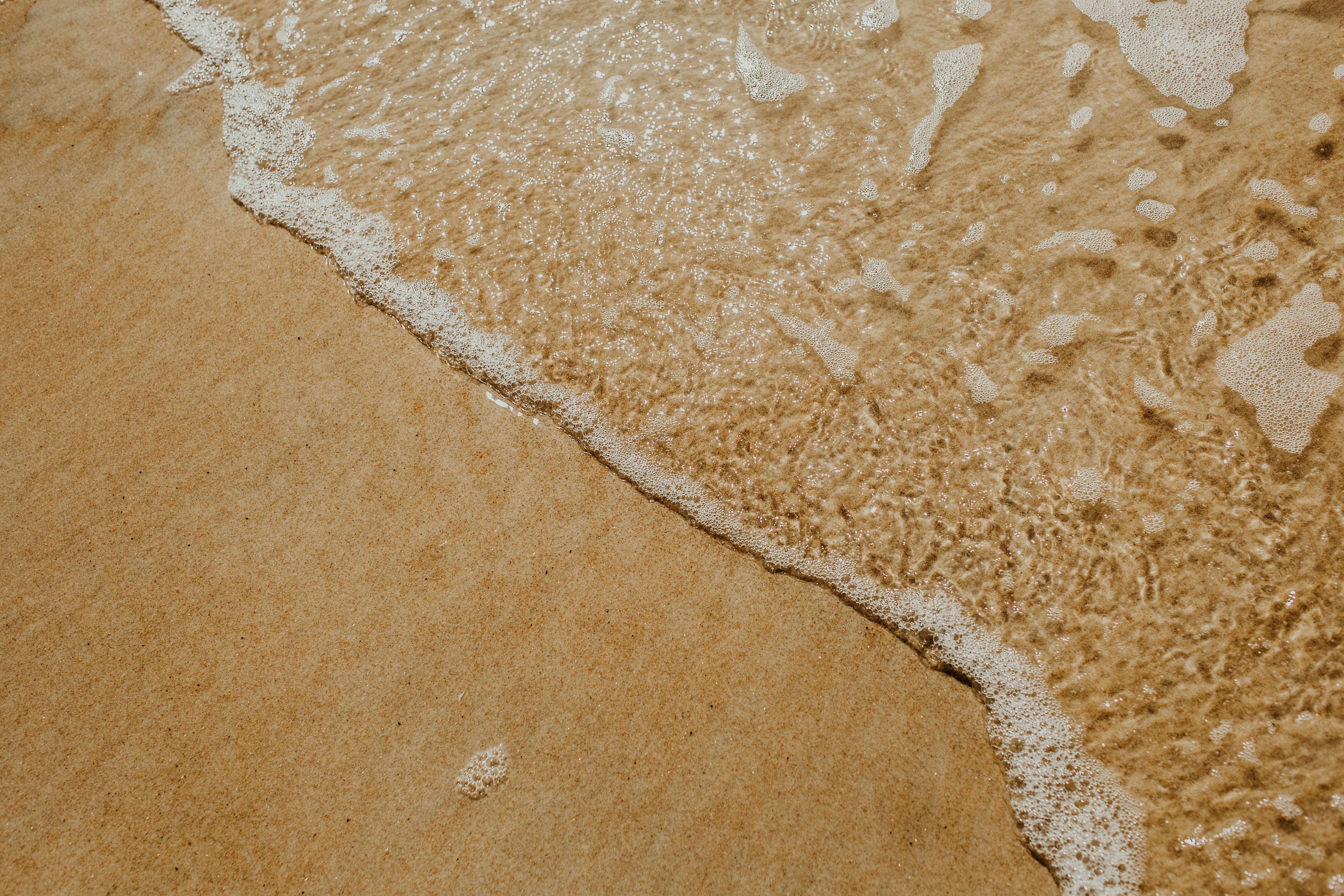 High-Angle Photo of Saltwater on Shore · Free Stock Photo