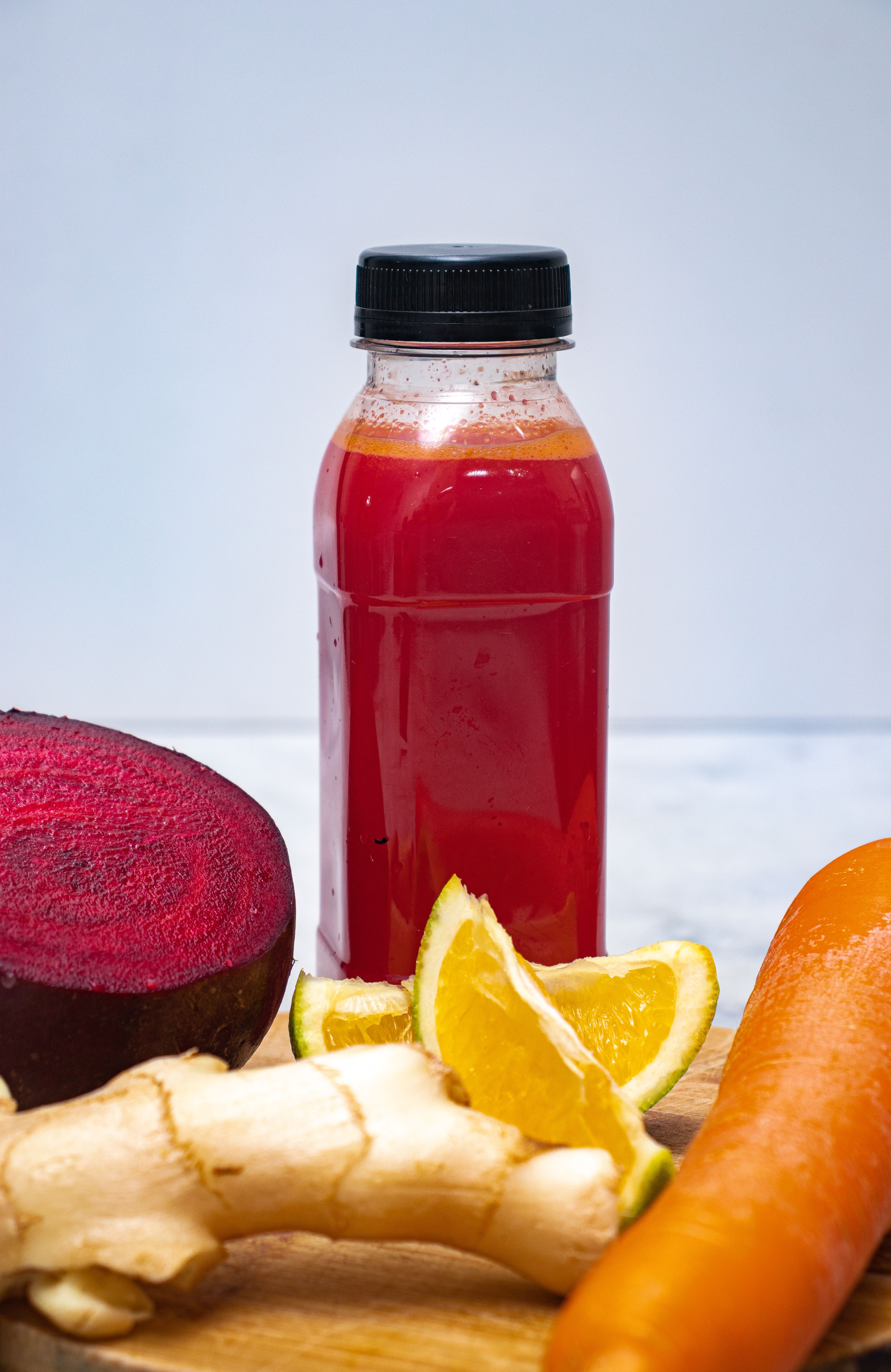 Colorful Fresh Juice with Ingredients on Display · Free Stock Photo