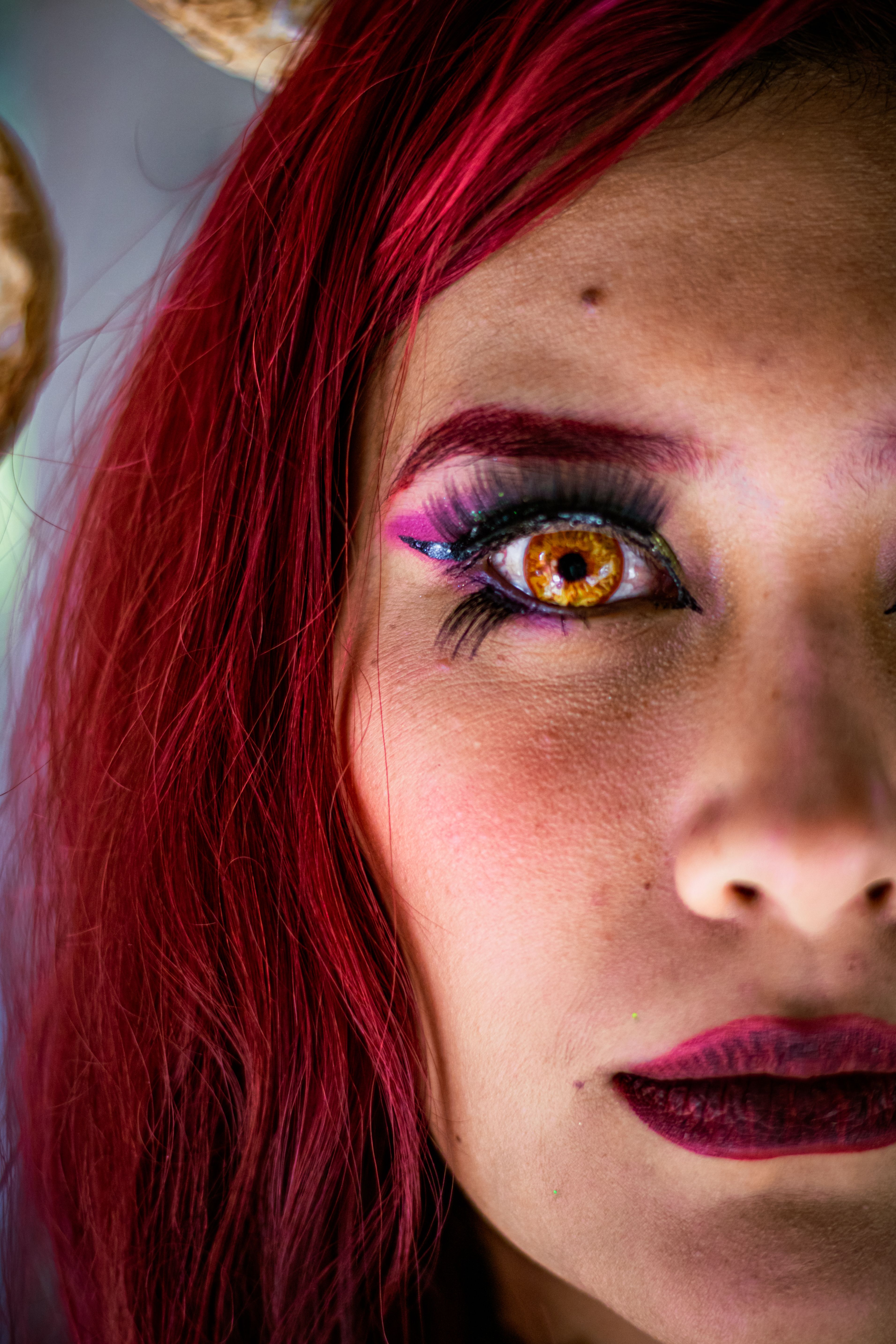 Creative Cosplay Makeup with Red Hair and Yellow Eyes · Free Stock Photo