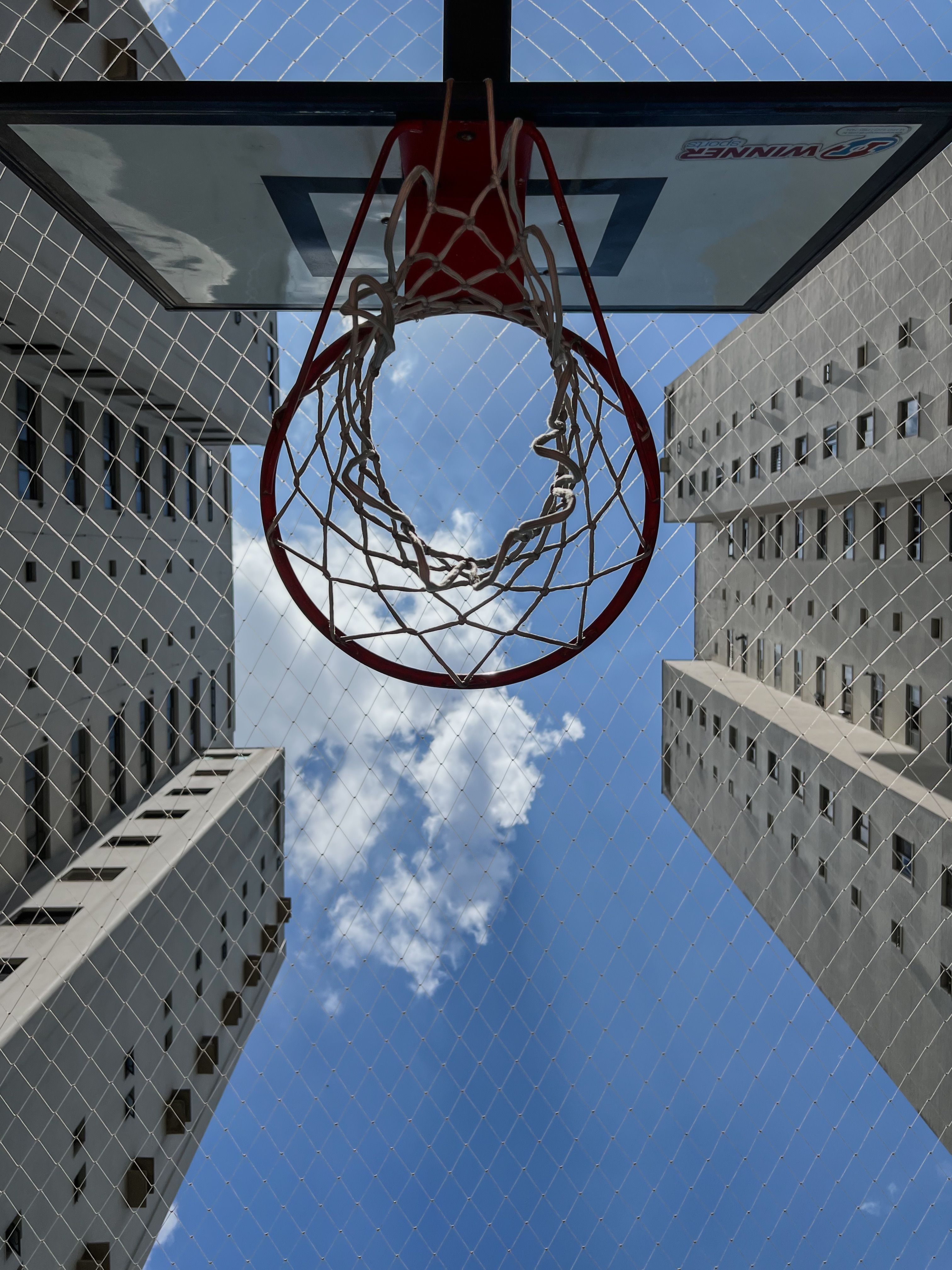 Basketball Hoop with São Paulo Skyscrapers · Free Stock Photo