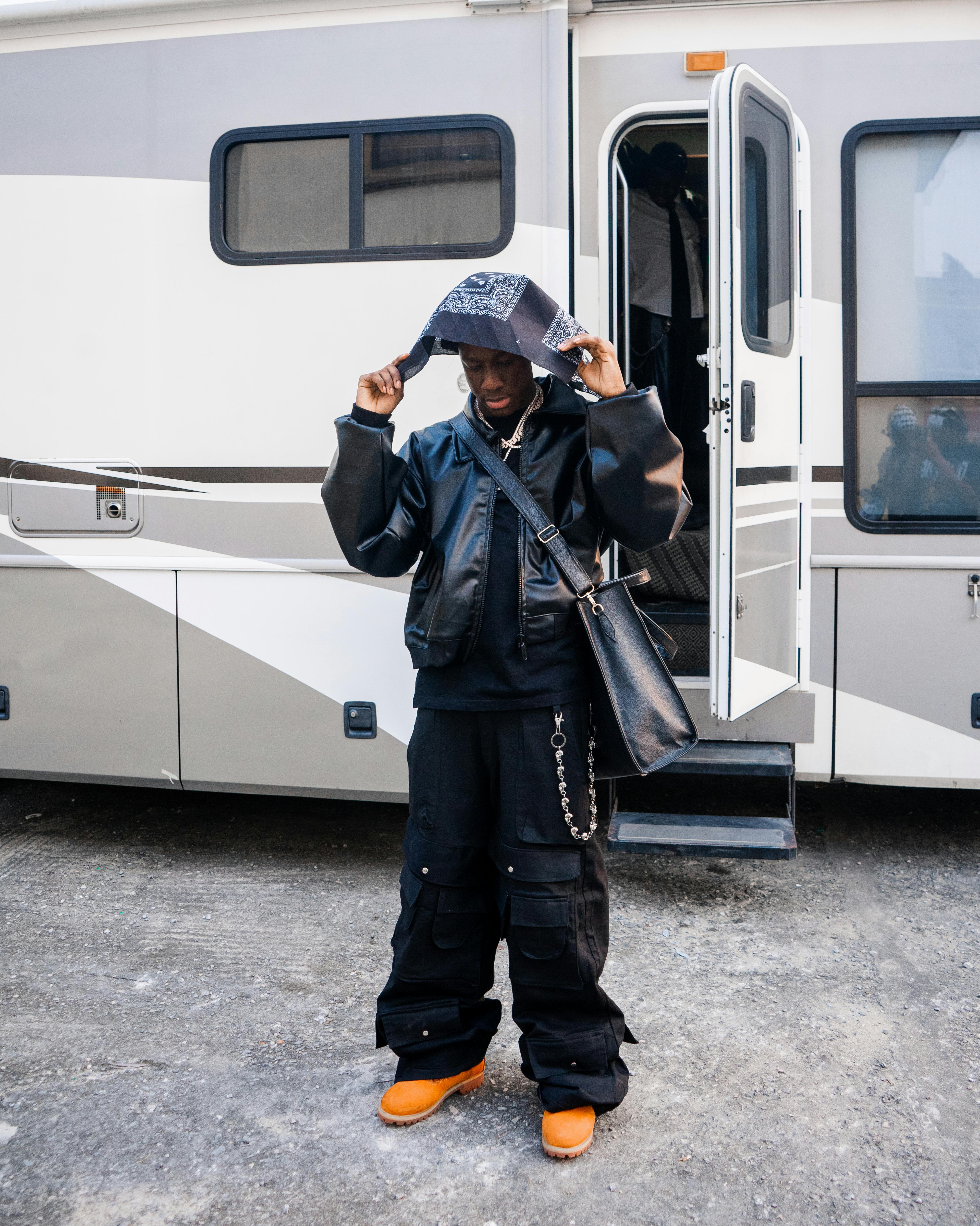 Fashionable individual outside a camper van · Free Stock Photo