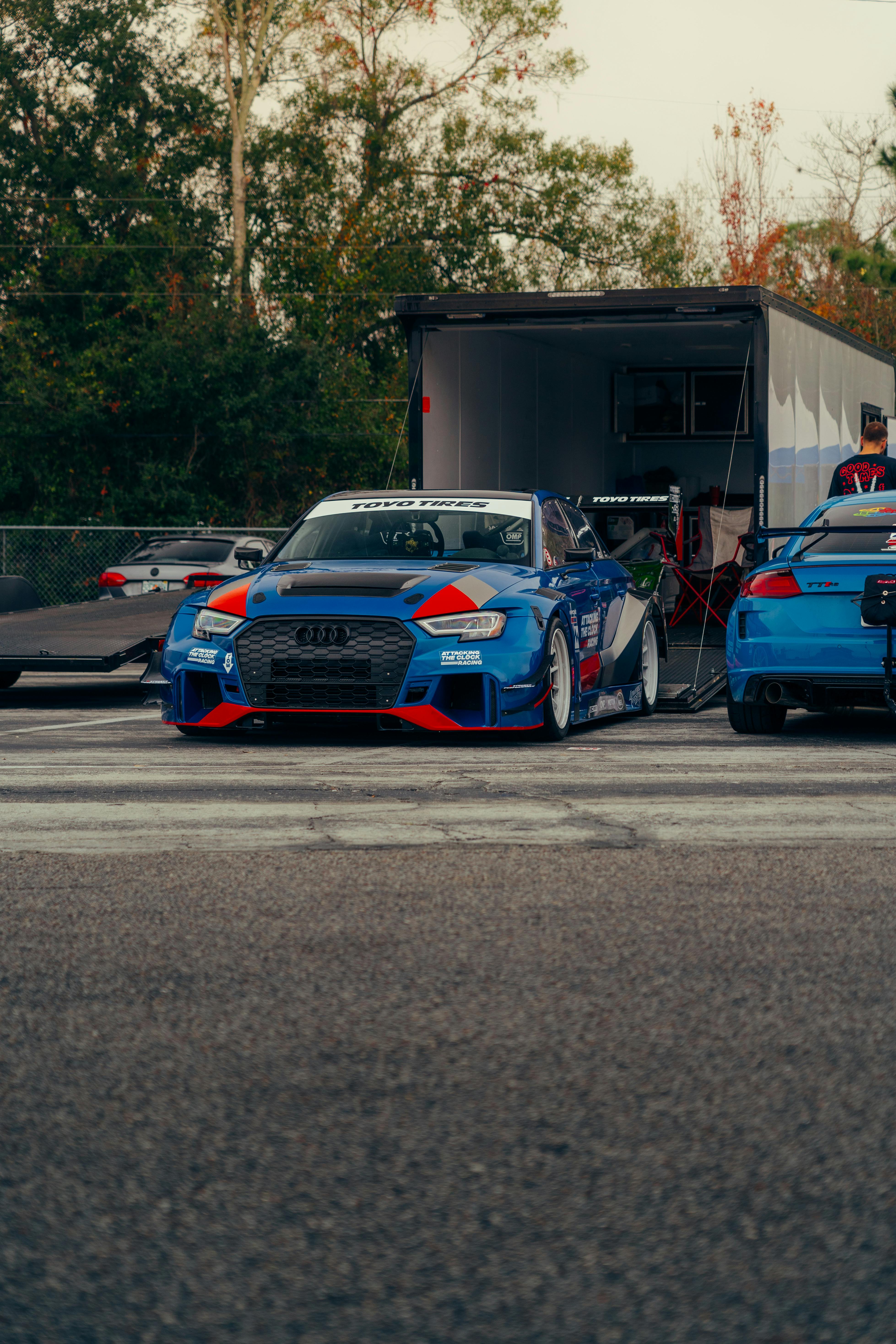 Colorful Racing Cars at Outdoor Track · Free Stock Photo