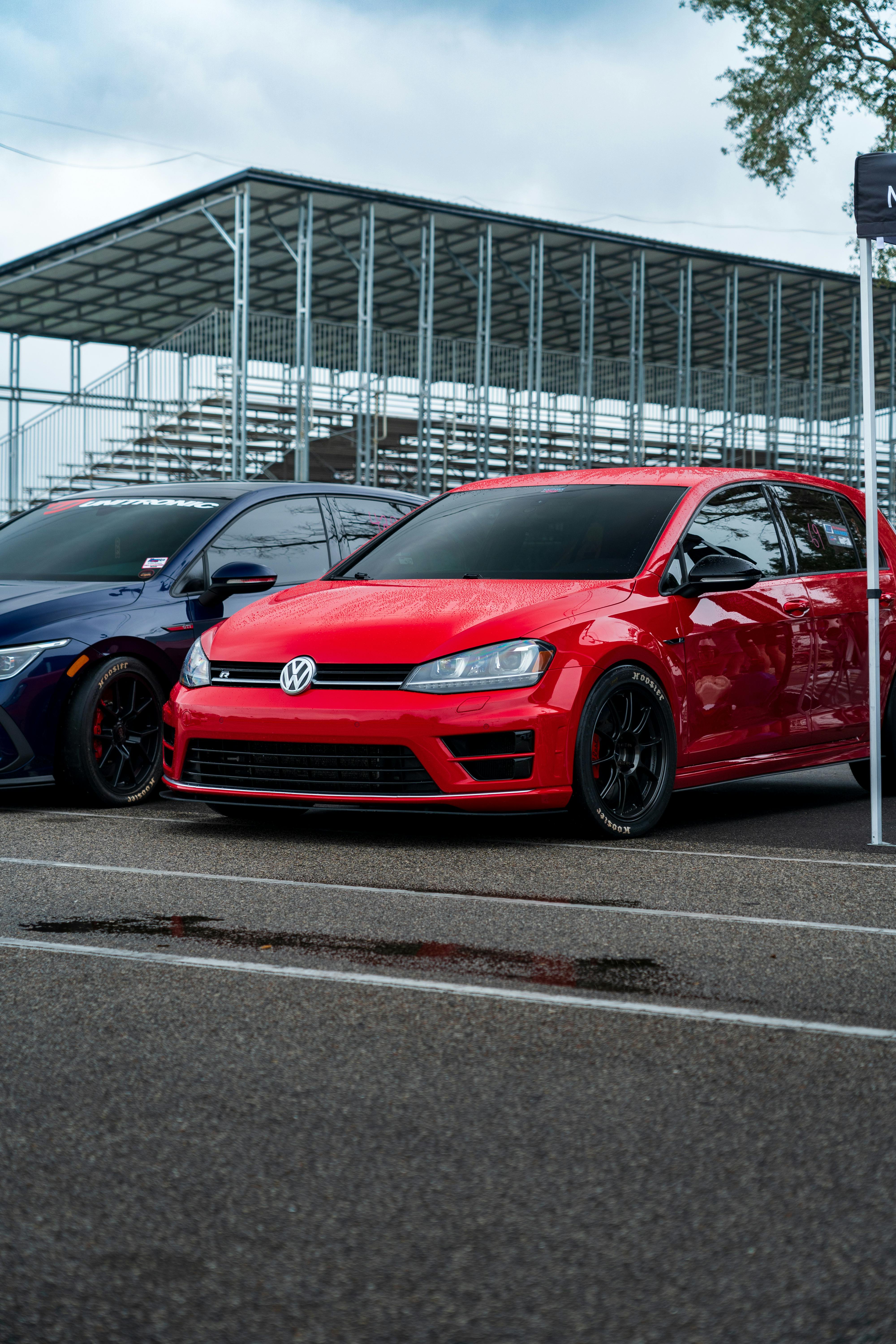 Red Volkswagen Car at Outdoor Auto Show · Free Stock Photo