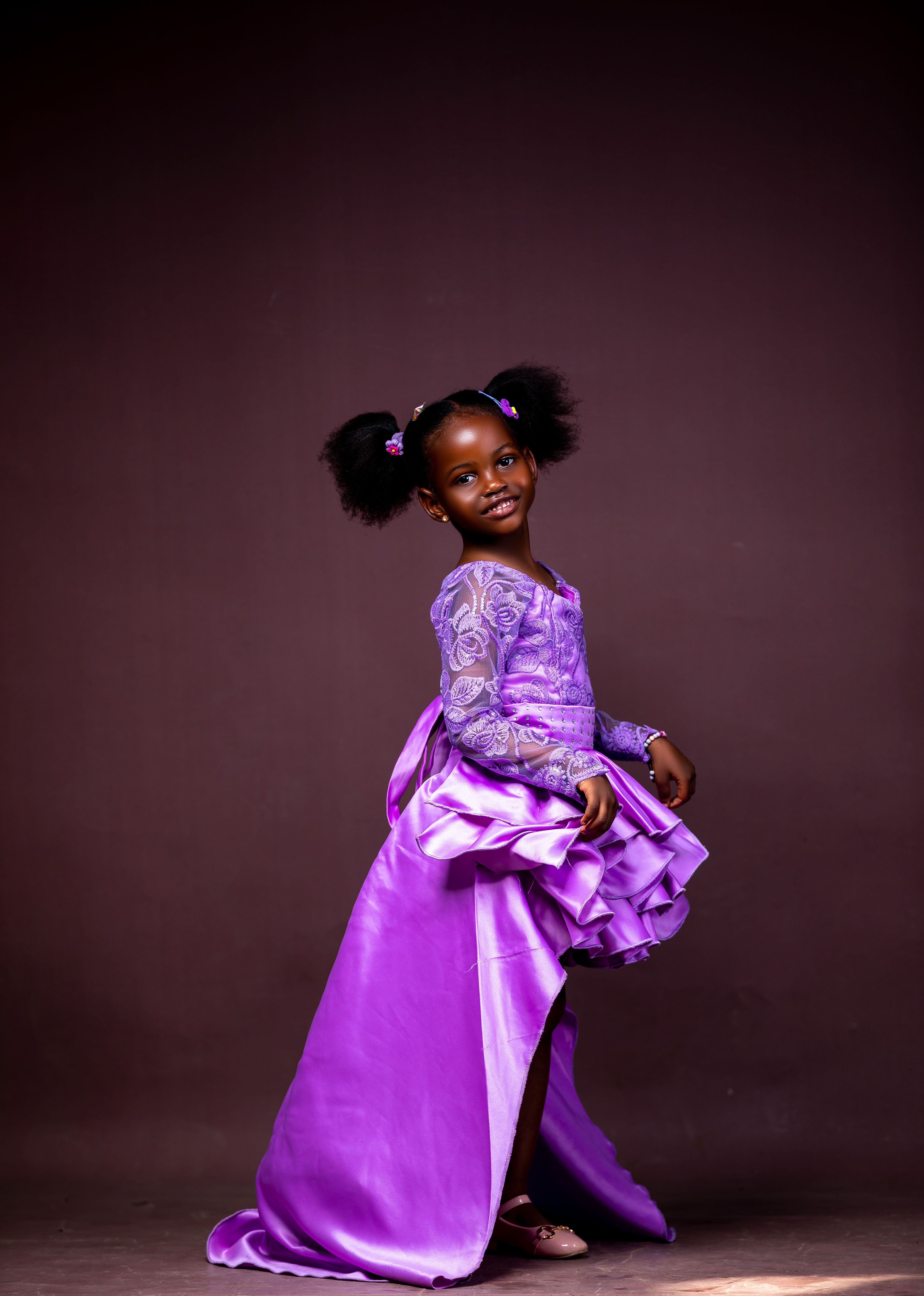 Joyful Child in Purple Dress Studio Portrait · Free Stock Photo